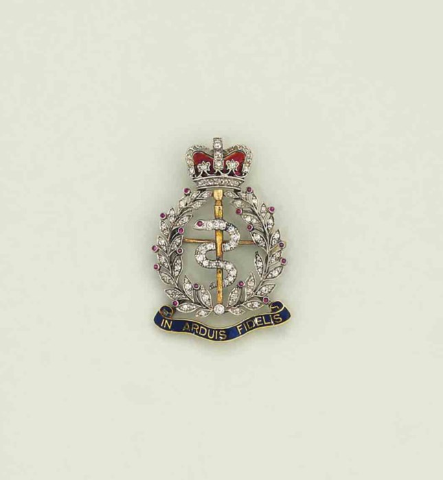 A diamond, ruby and enamel regimental badge brooch | Christie's
