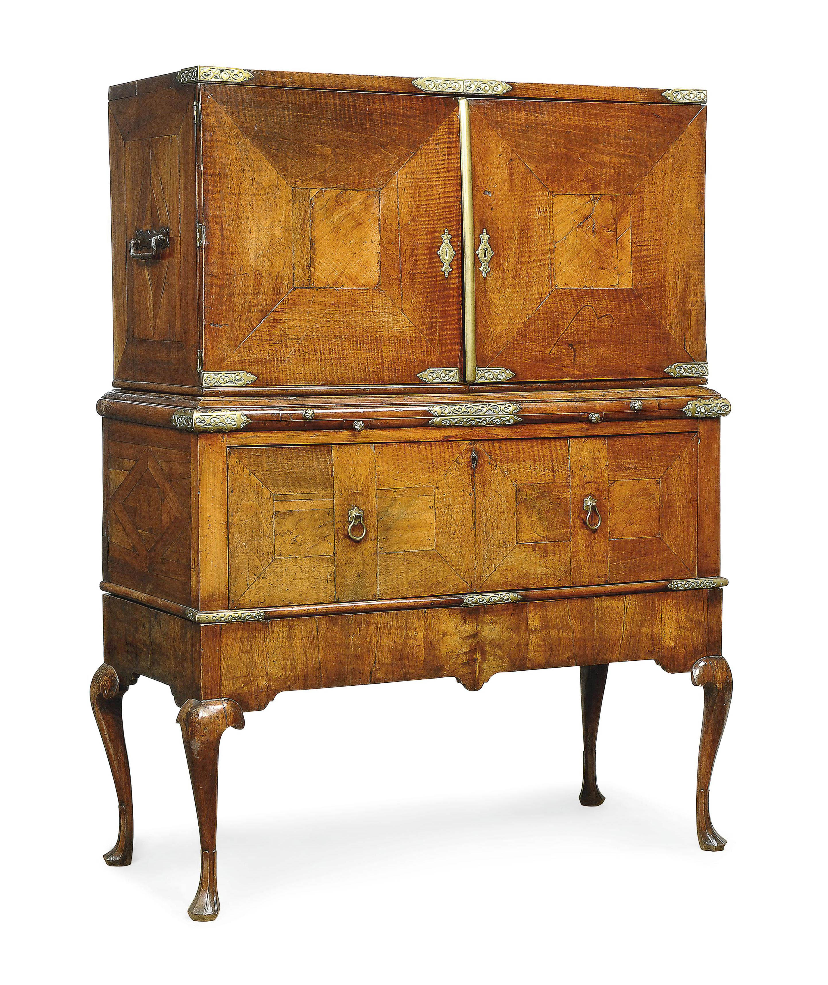 A WILLIAM AND MARY WALNUT AND BRASS-MOUNTED CABINET-ON-STAND