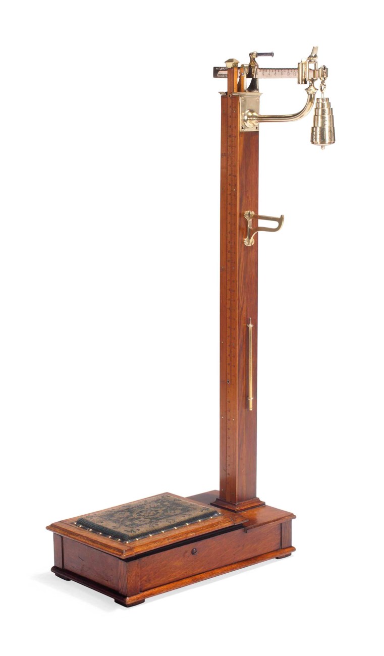 A SET OF EDWARDIAN OAK AND BRASS FLOOR STANDING SCALES , BY W. & T ...