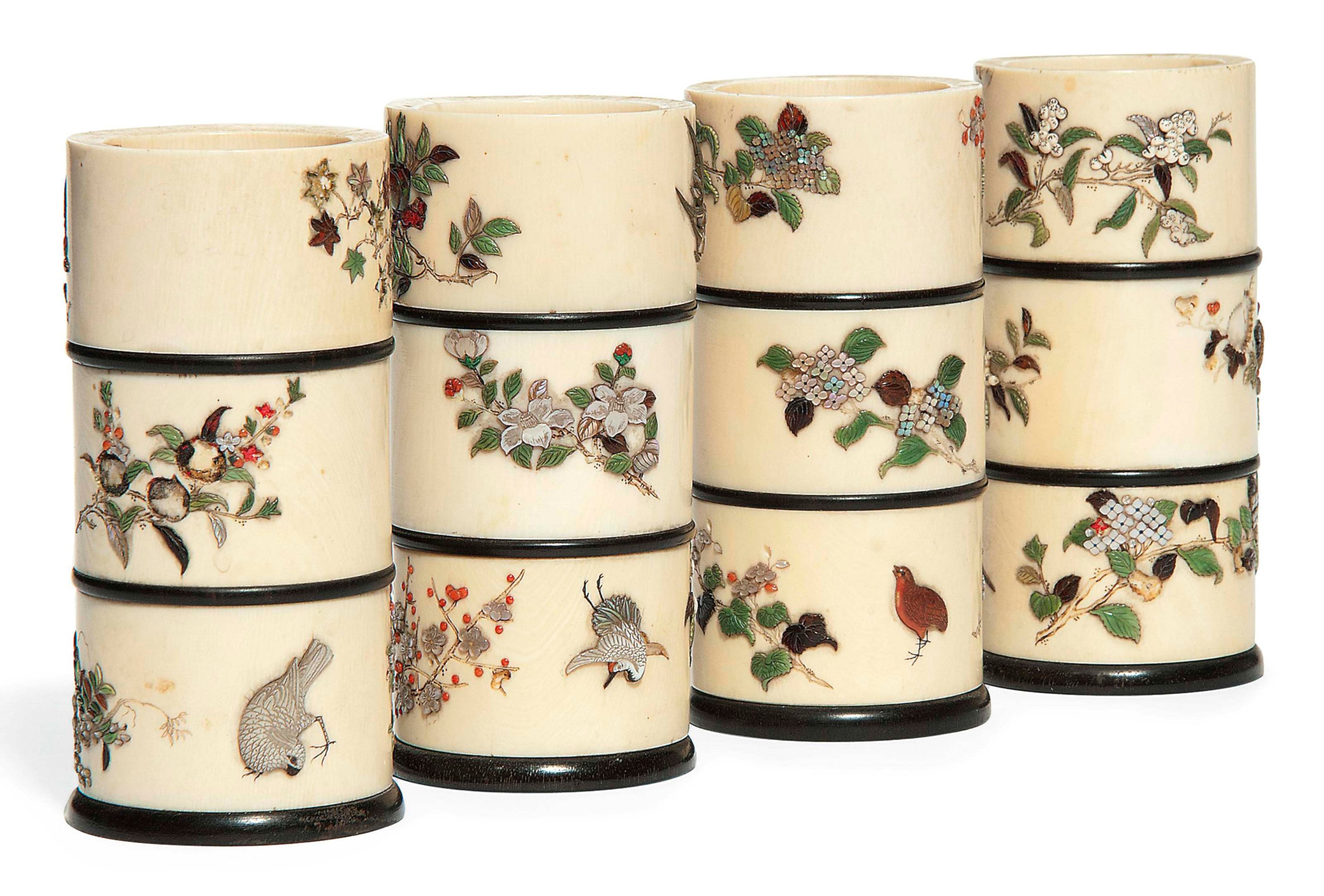 A SET OF FOUR JAPANESE SHIBAYAMA-STYLE IVORY AND EBONY BRUSH POTS ...