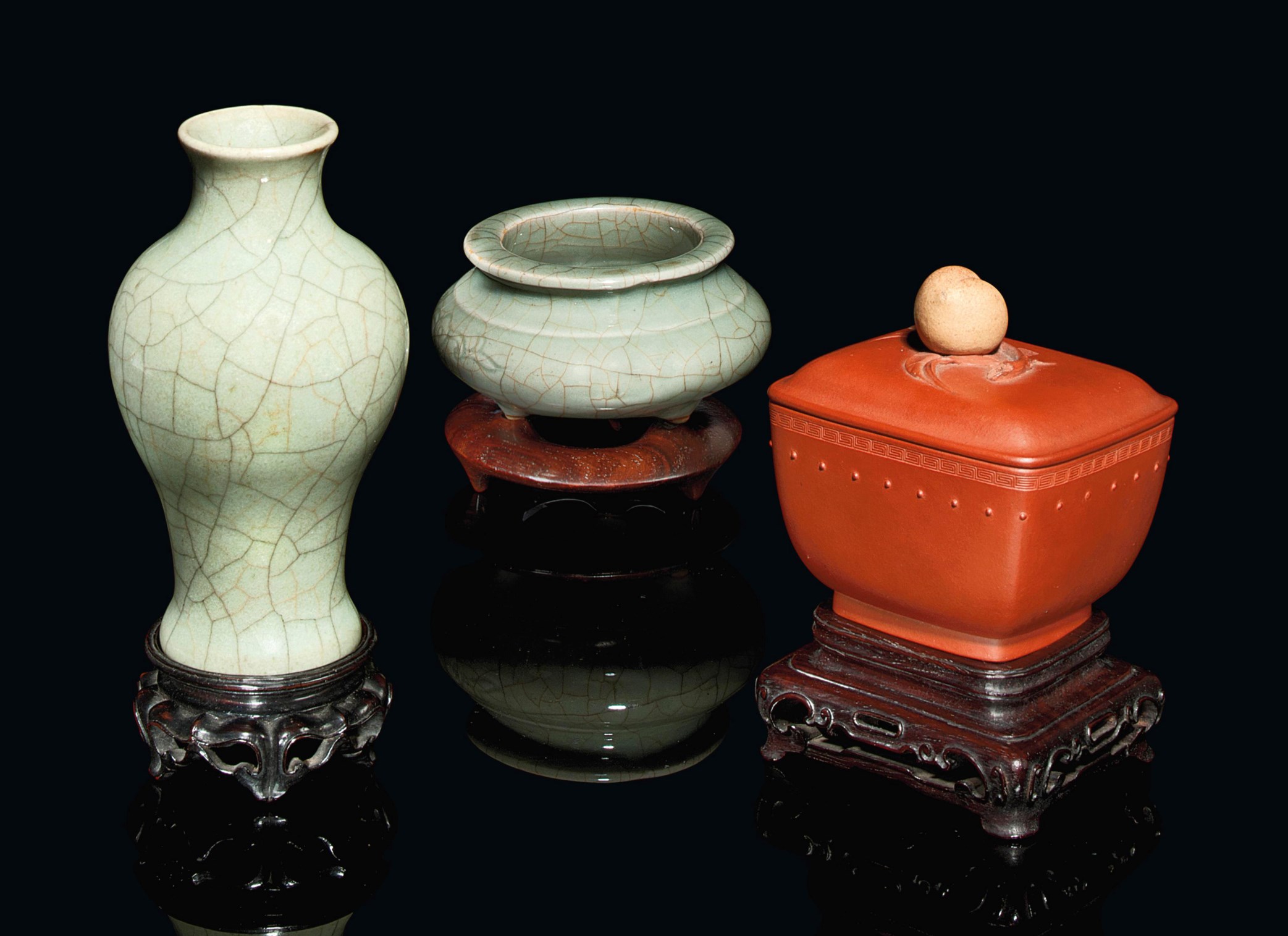 A CHINESE YIXING POTTERY VESSEL AND COVER AND TWO CRACKLE-GLAZED ...