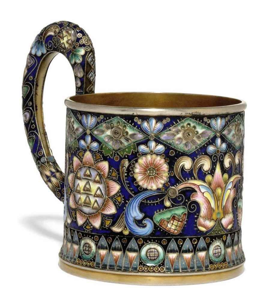 A RUSSIAN SILVER-GILT AND CLOISONNE ENAMEL TEA-GLASS HOLDER , MARK OF ...