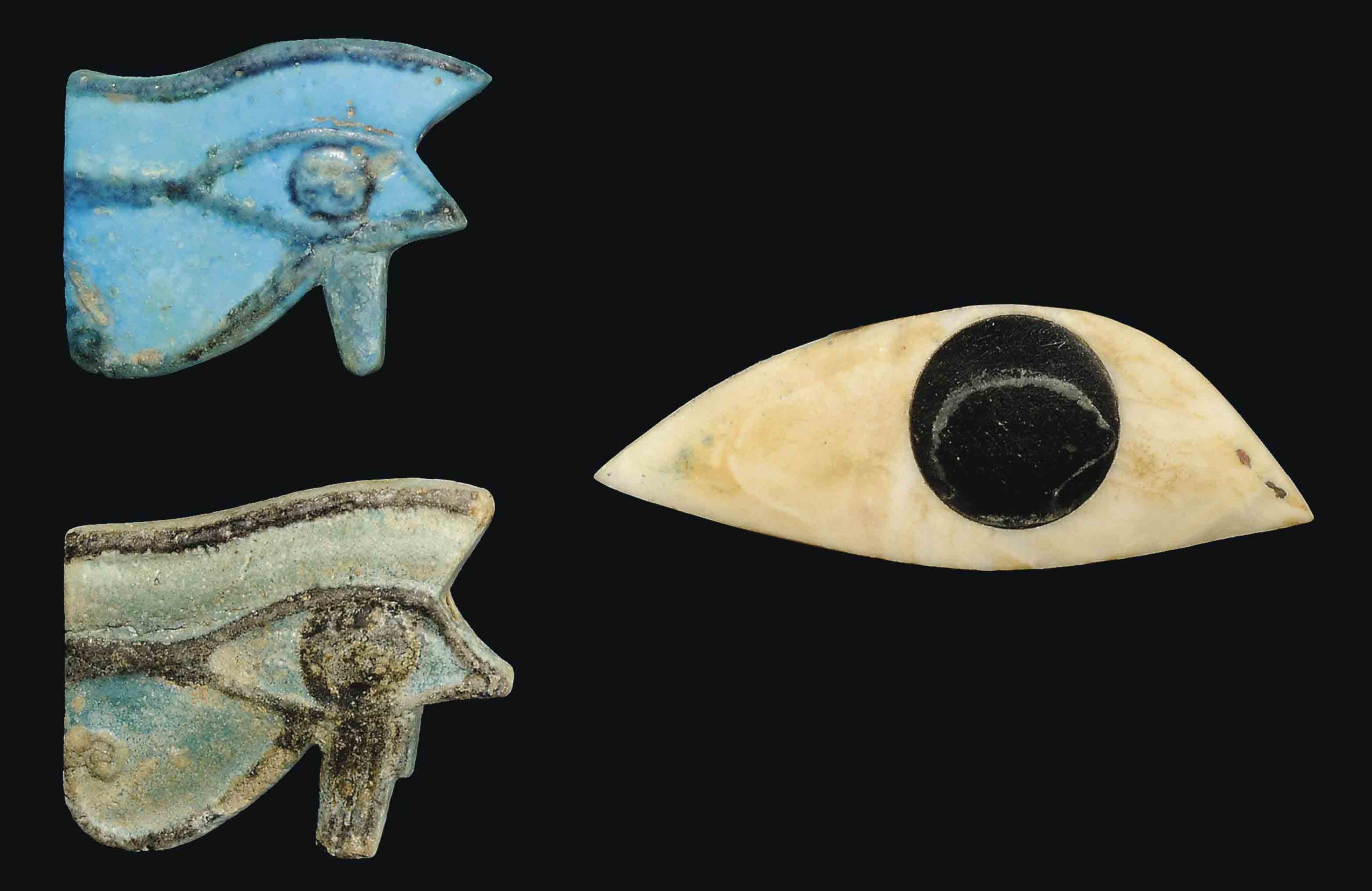 AN EGYPTIAN OBSIDIAN AND LIMESTONE EYE INLAY