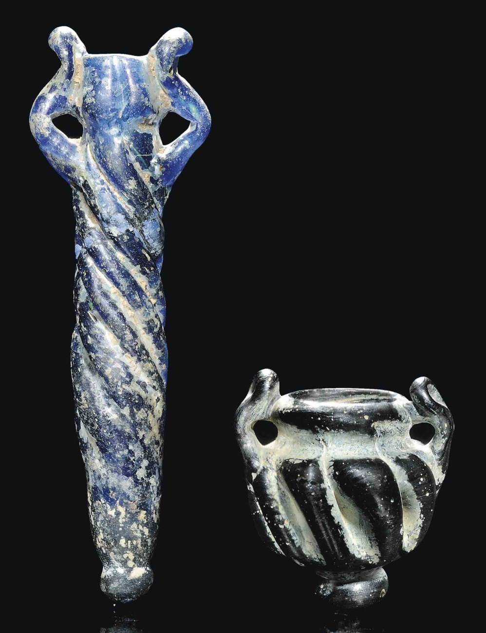 A BYZANTINE BLUE GLASS BALSAMARIUM , CIRCA 5TH-7TH CENTURY A.D ...