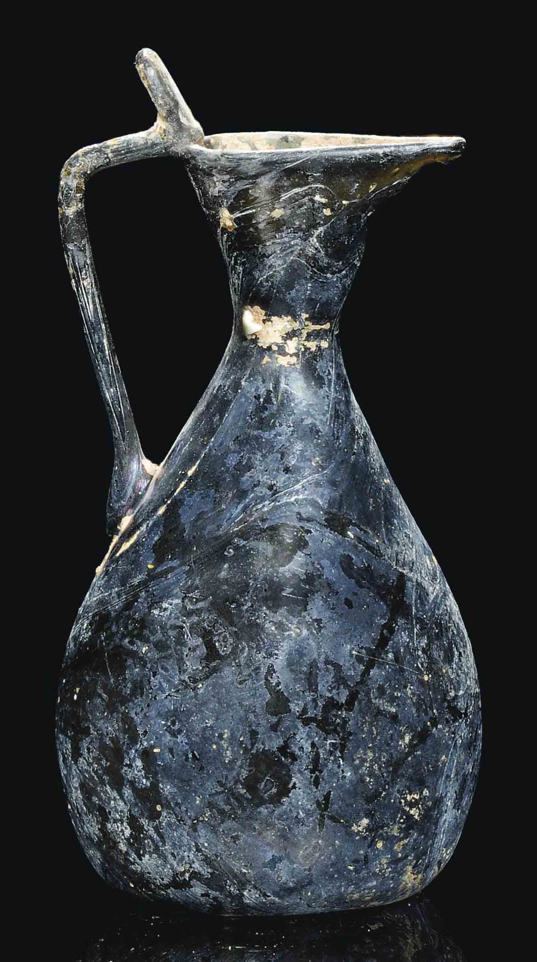 AN EARLY ISLAMIC GLASS FLASK , CIRCA 9TH CENTURY A.D. | Christie's
