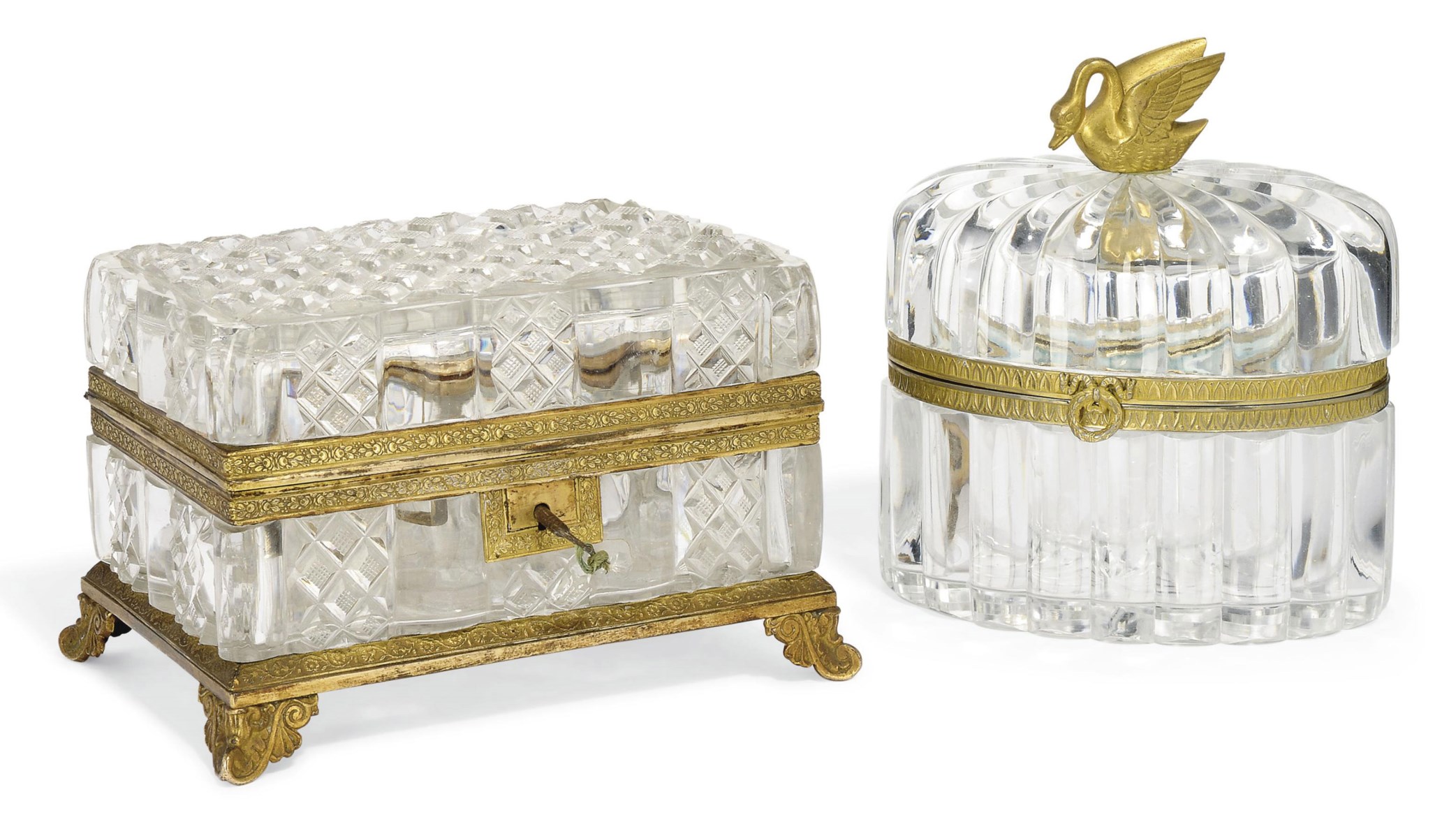 TWO CLEAR GLASS CUT AND MOULDED GILT-METAL-MOUNTED CASKETS , LATE 19TH ...