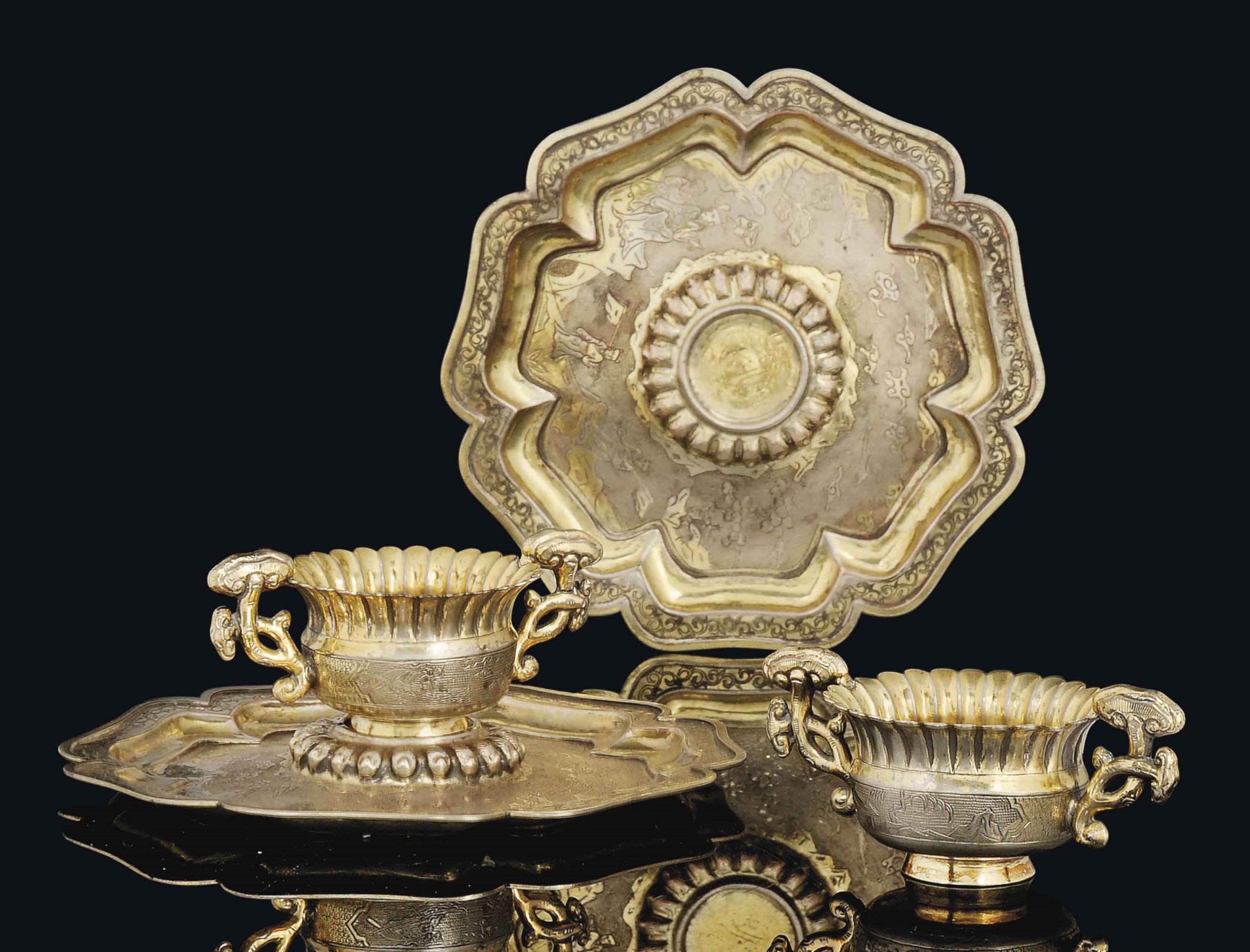 A PAIR OF PARCEL-GILT SILVER CUPS AND CUP-STANDS , 18TH/19TH CENTURY ...
