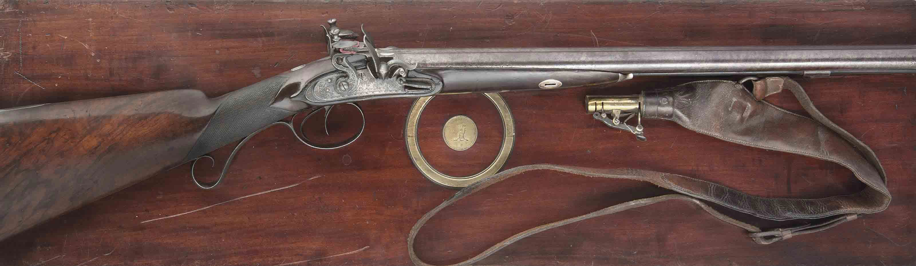 A CASED 18-BORE DOUBLE-BARRELLED FLINTLOCK SPORTING GUN , BY T ...