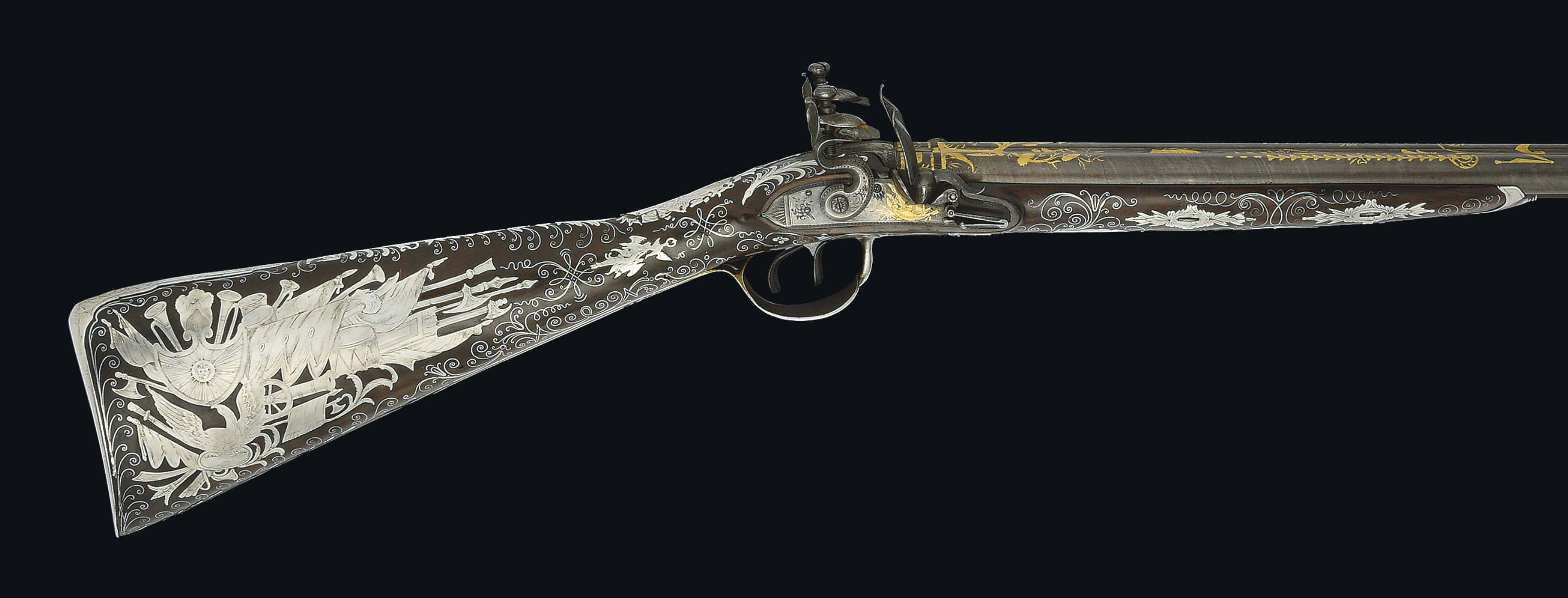 A HIGHLY ORNATE 22-BORE SILVER-MOUNTED DOUBLE-BARRELLED FLINTLOCK ...