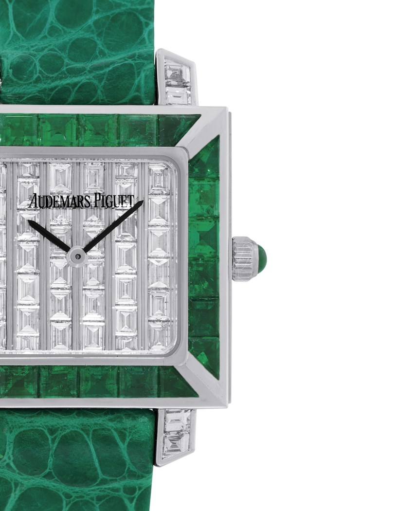 AUDEMARS PIGUET. A LADY'S FINE 18K WHITE GOLD, EMERALD AND DIAMOND-SET ...