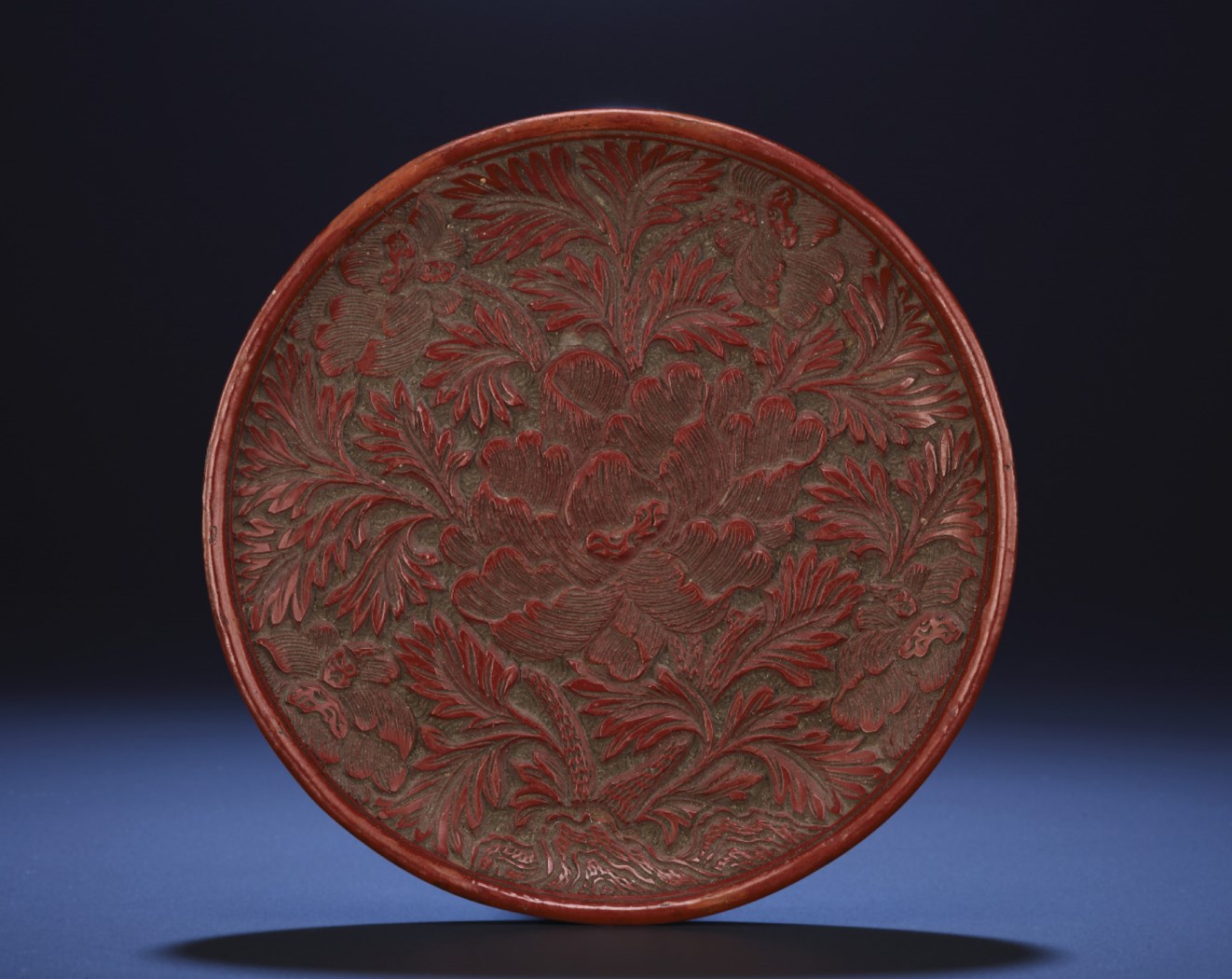 A MING YUNNAN CINNABAR LACQUER CIRCULAR TRAY, MING DYNASTY, 16TH ...