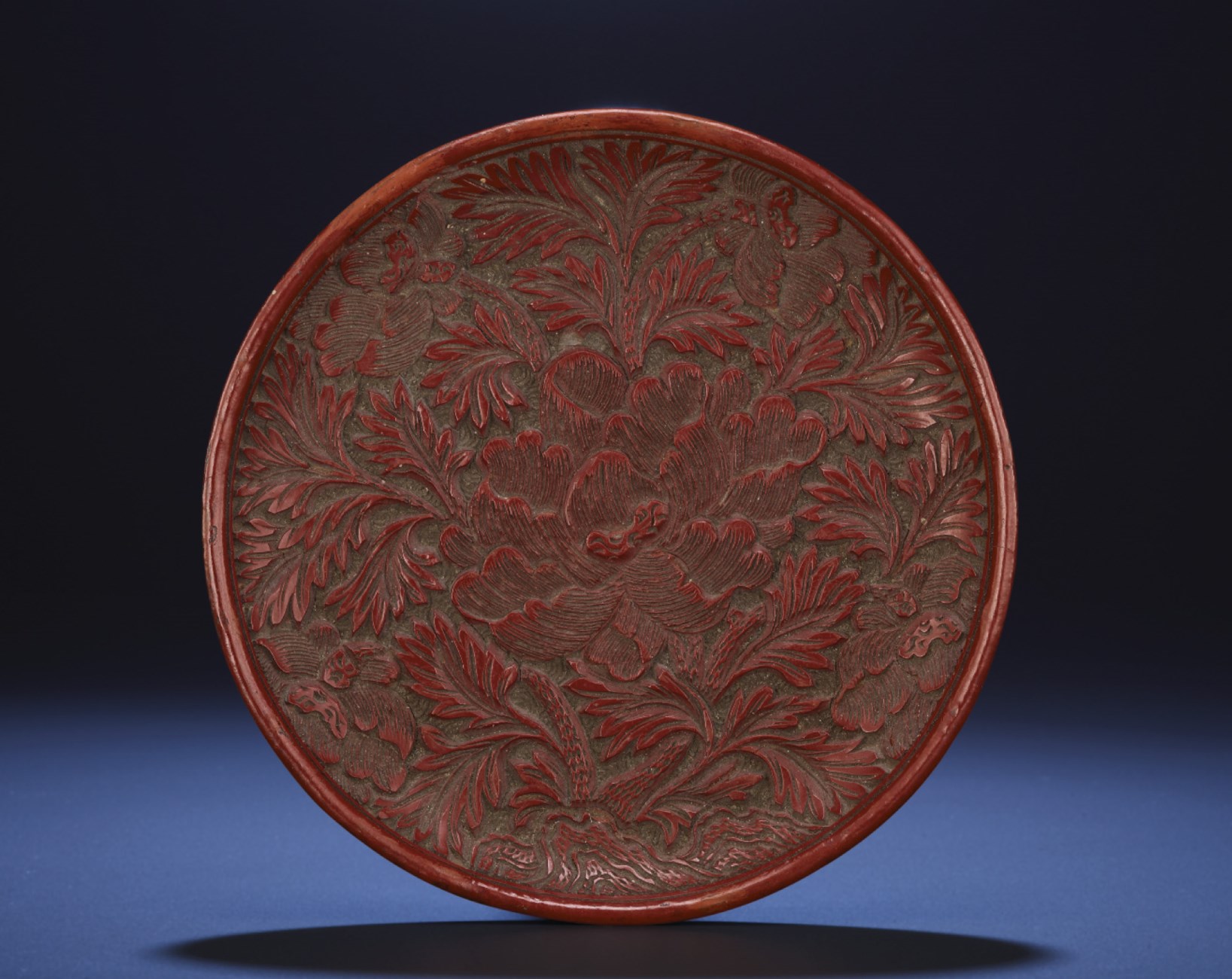 A MING YUNNAN CINNABAR LACQUER CIRCULAR TRAY, MING DYNASTY, 16TH ...