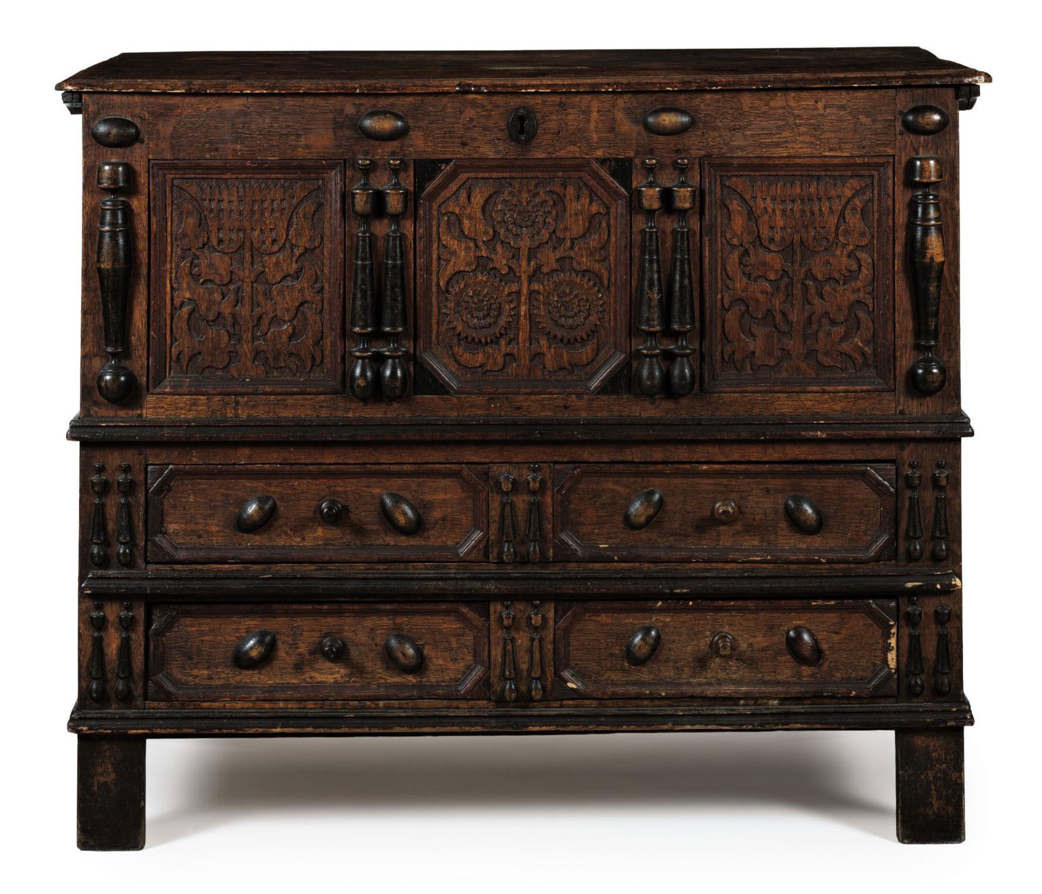 A JOINED AND PAINTED OAK CARVED "SUNFLOWER" CHEST WITH TWO DRAWERS ...