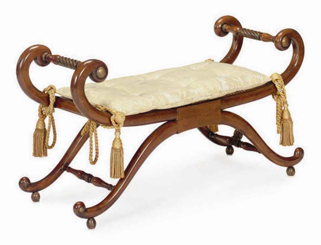 A PARCEL GILT MAHOGANY CURULE-FORM BENCH,