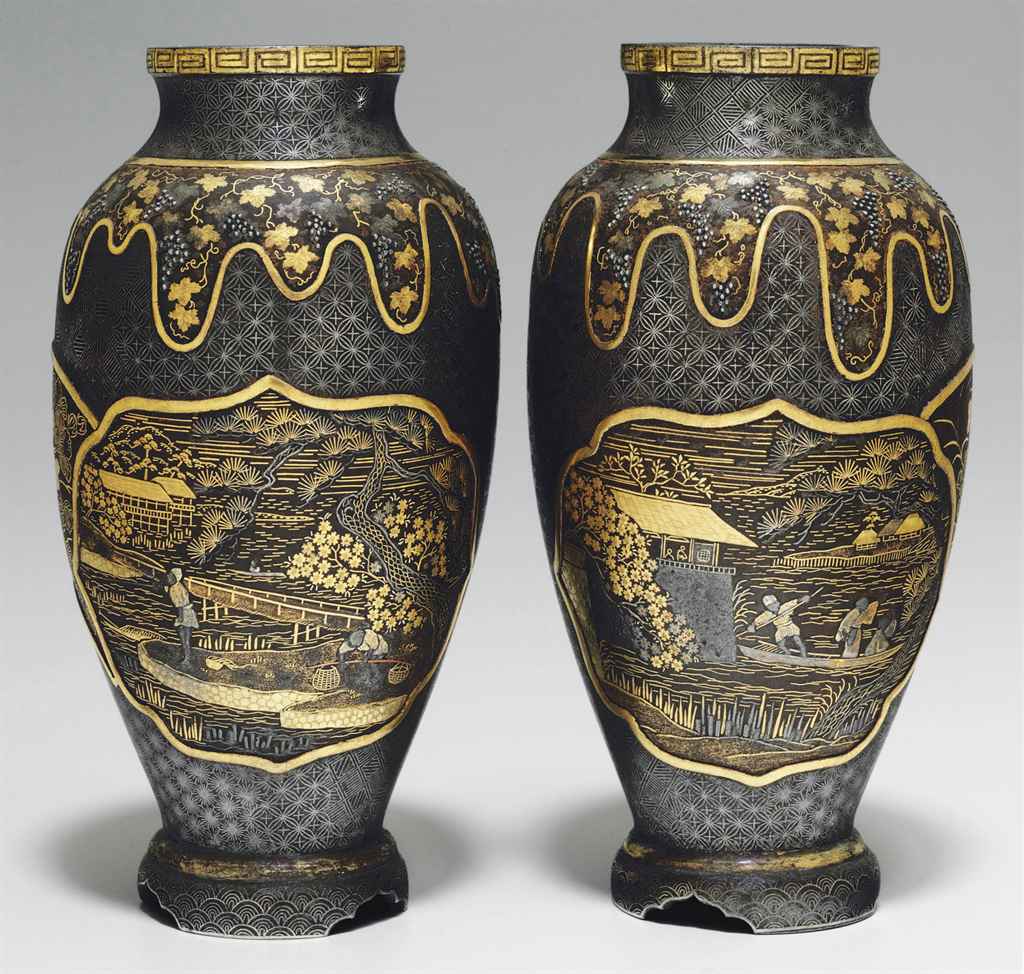 A pair of inlaid-iron vases