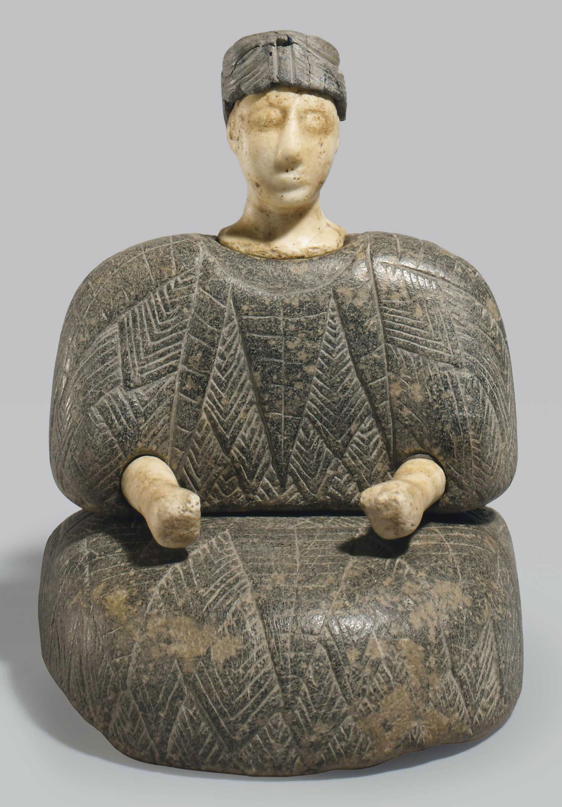 A BACTRIAN COMPOSITE STONE SEATED FEMALE FIGURE , BACTRIA-MARGIANA ...