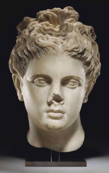 A ROMAN MARBLE HEAD OF APOLLO , CIRCA LATE 1ST-EARLY 2ND CENTURY A.D ...