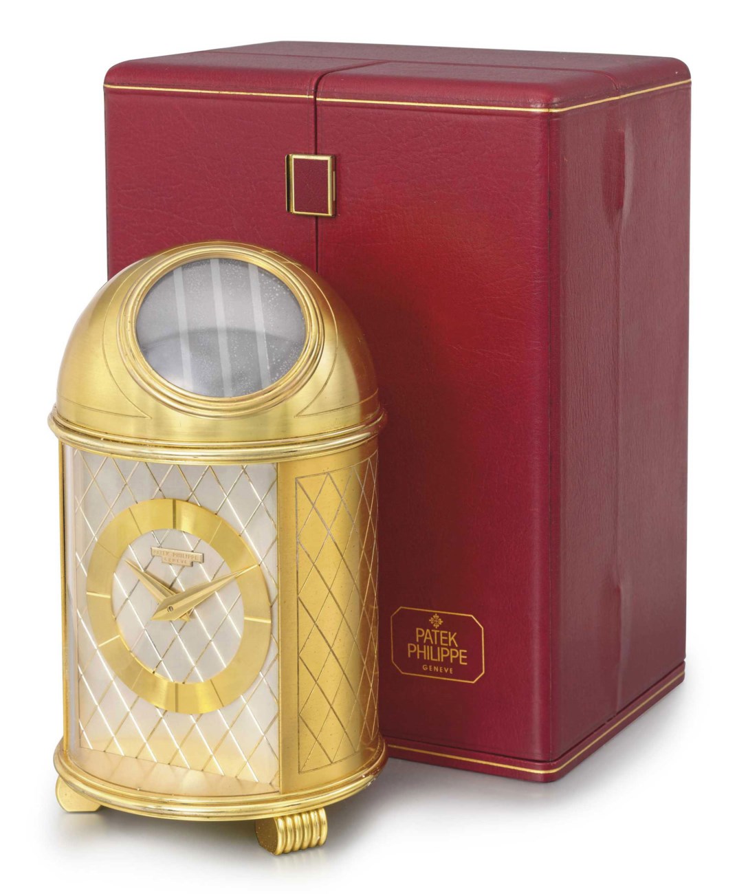 PATEK PHILIPPE. A FINE GILT BRASS SOLAR-POWERED DOMED TABLE CLOCK WITH ...
