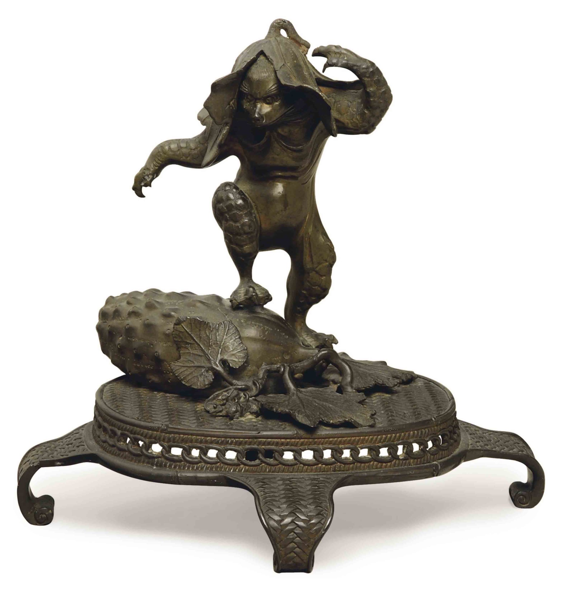 A JAPANESE BRONZE FIGURE OF THE WATER IMP KAPPA ON A BASKET WEAVE BASE ...