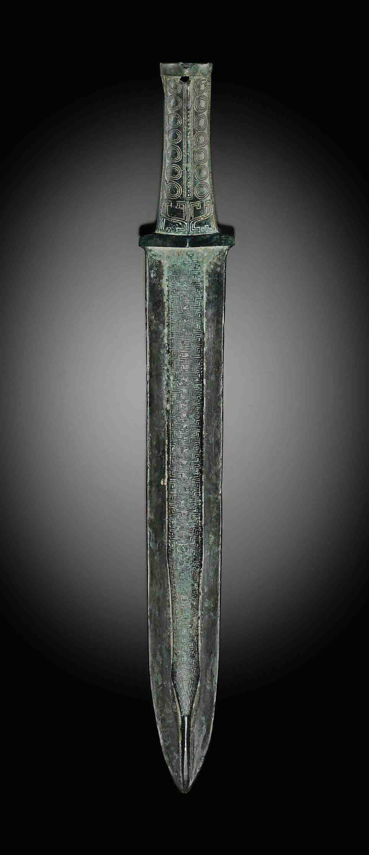 AN UNUSUAL BRONZE DAGGER