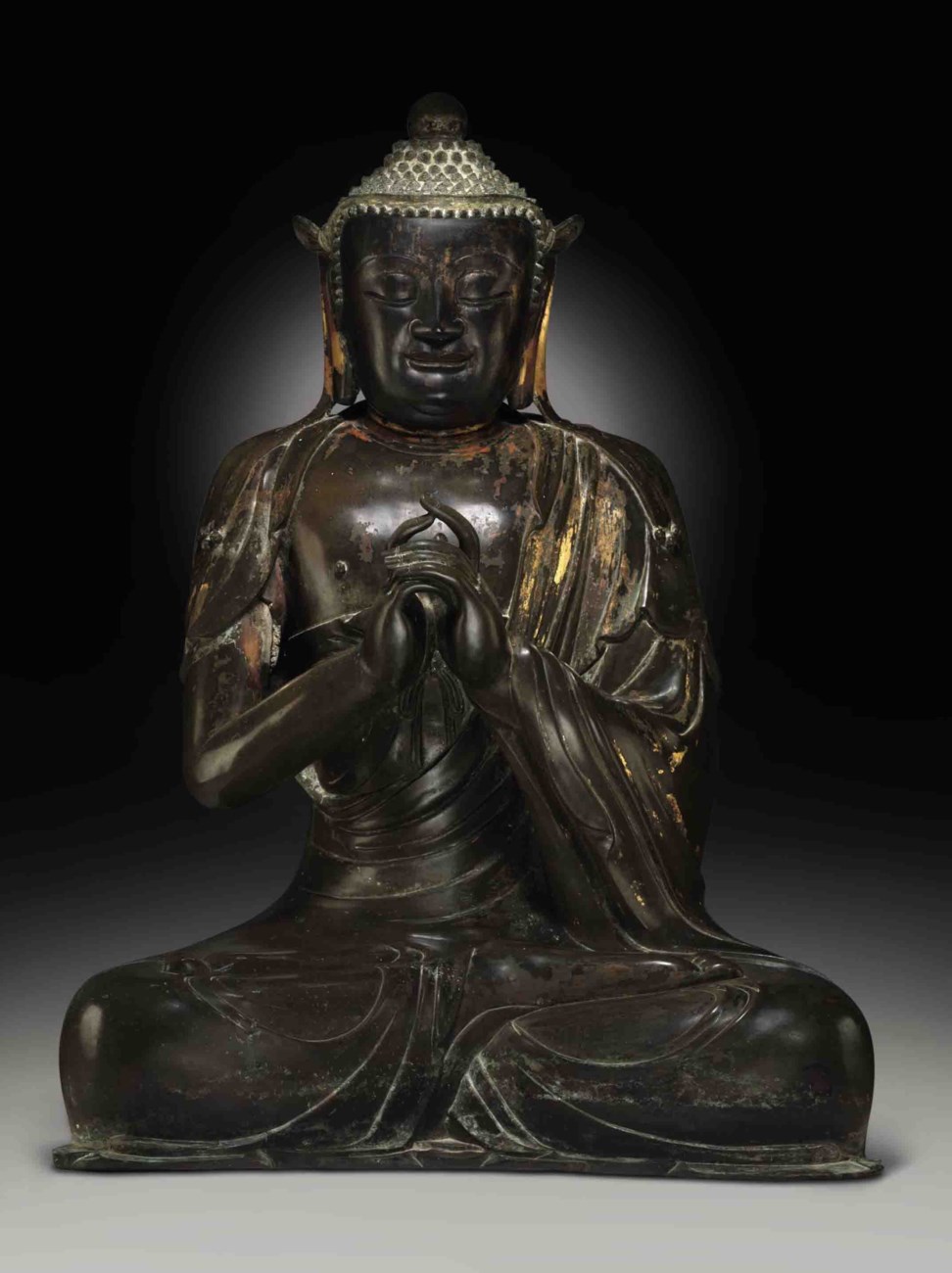 A RARE MASSIVE GILT-LACQUERED BRONZE FIGURE OF VAIROCANA