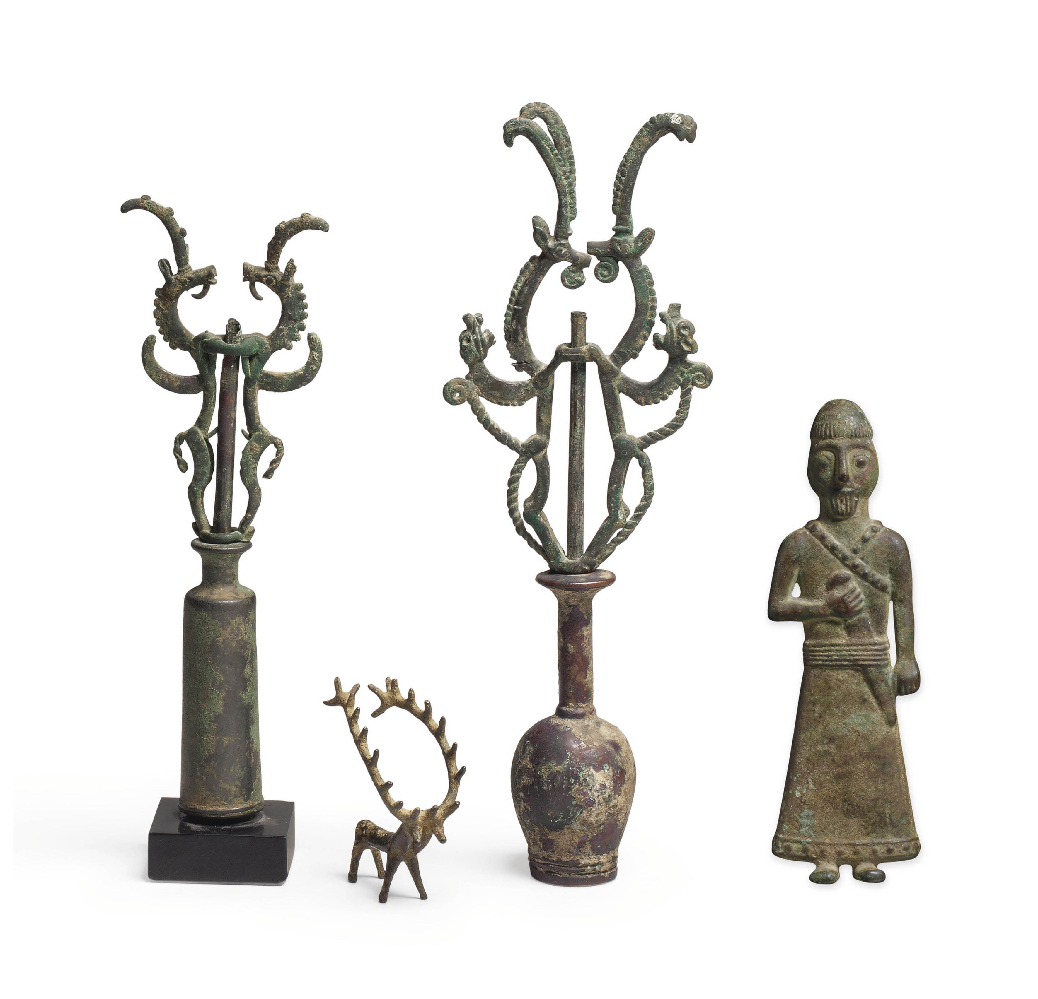 FOUR IRANIAN BRONZE OBJECTS , CIRCA EARLY 1ST MILLENNIUM B.C. | Christie's