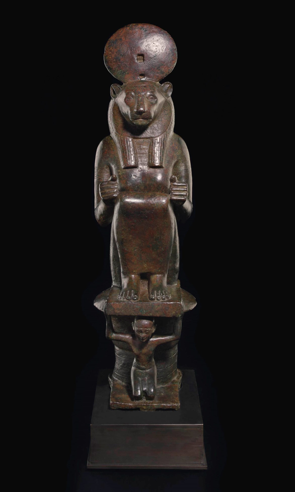 AN EGYPTIAN BRONZE WADJET , THIRD INTERMEDIATE PERIOD, DYNASTY XXI-XXII ...