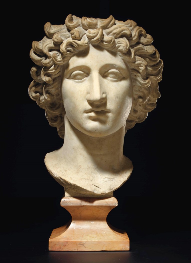 A ROMAN MARBLE HEAD OF SOL