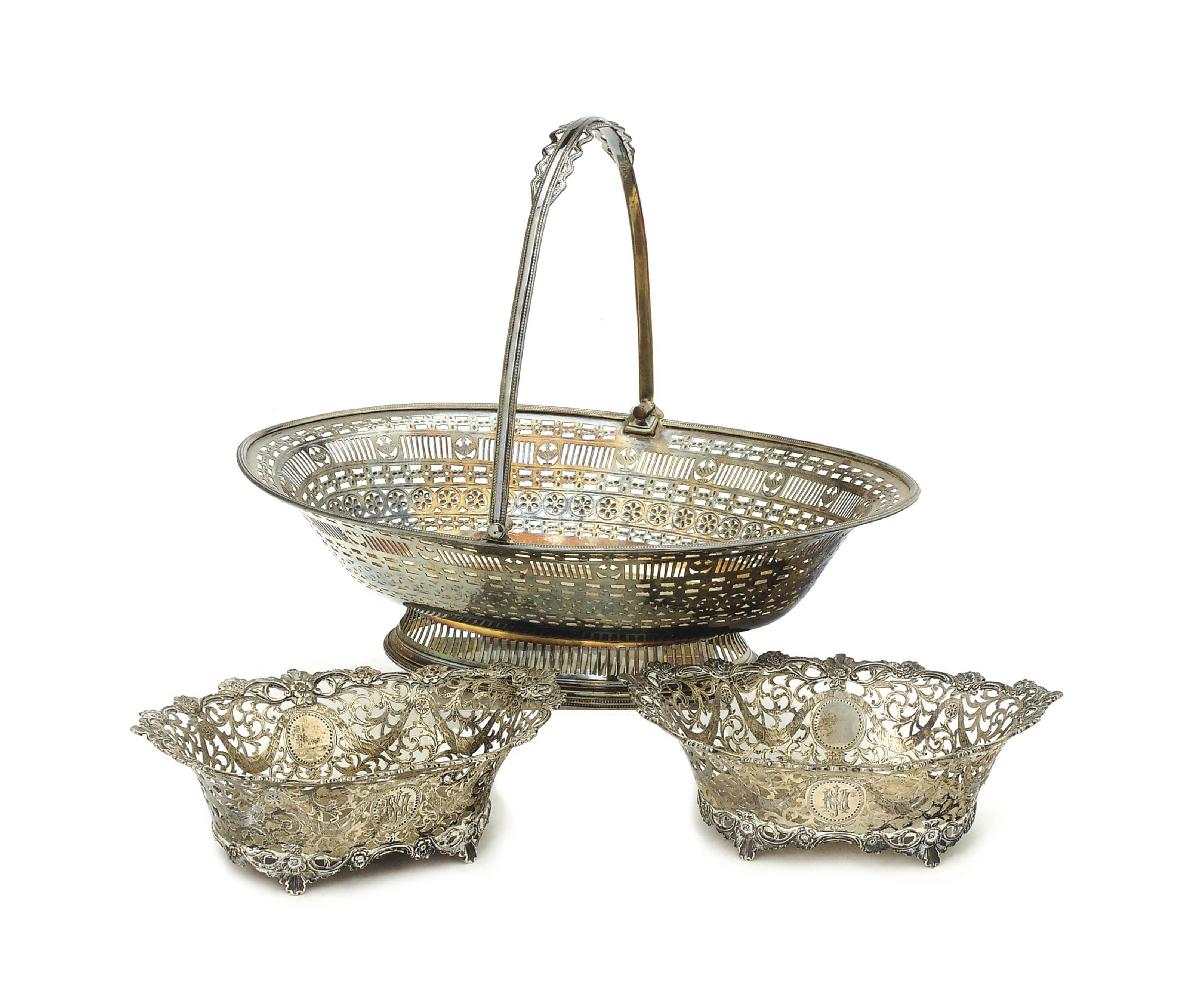 A SET OF FOUR EDWARD VII SILVER SWEATMEAT BASKETS, AND A SILVER-PLATED ...