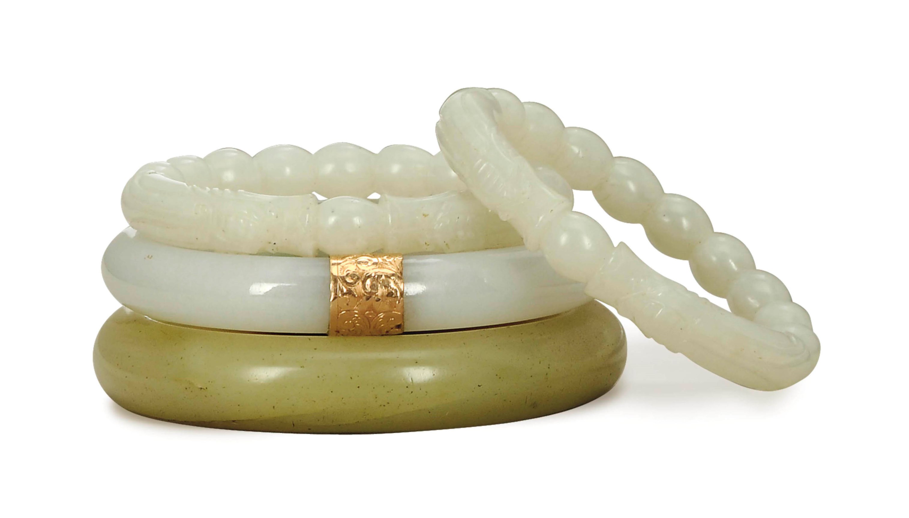 THREE CHINESE JADE BANGLES AND A JADEITE BANGLE, | Christie's