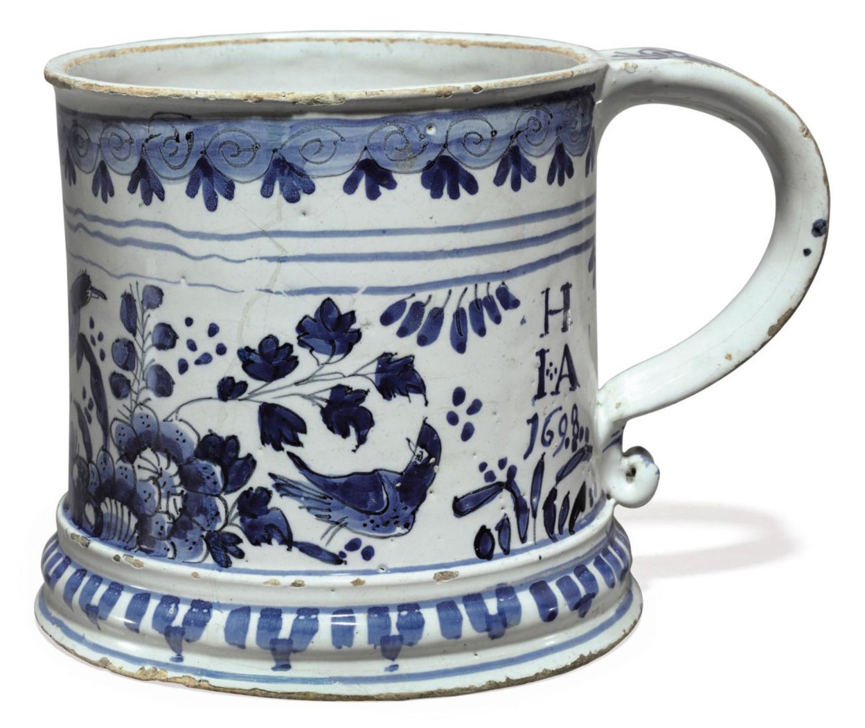 A LONDON DELFT DATED BLUE AND WHITE MUG , 1698 | Christie's