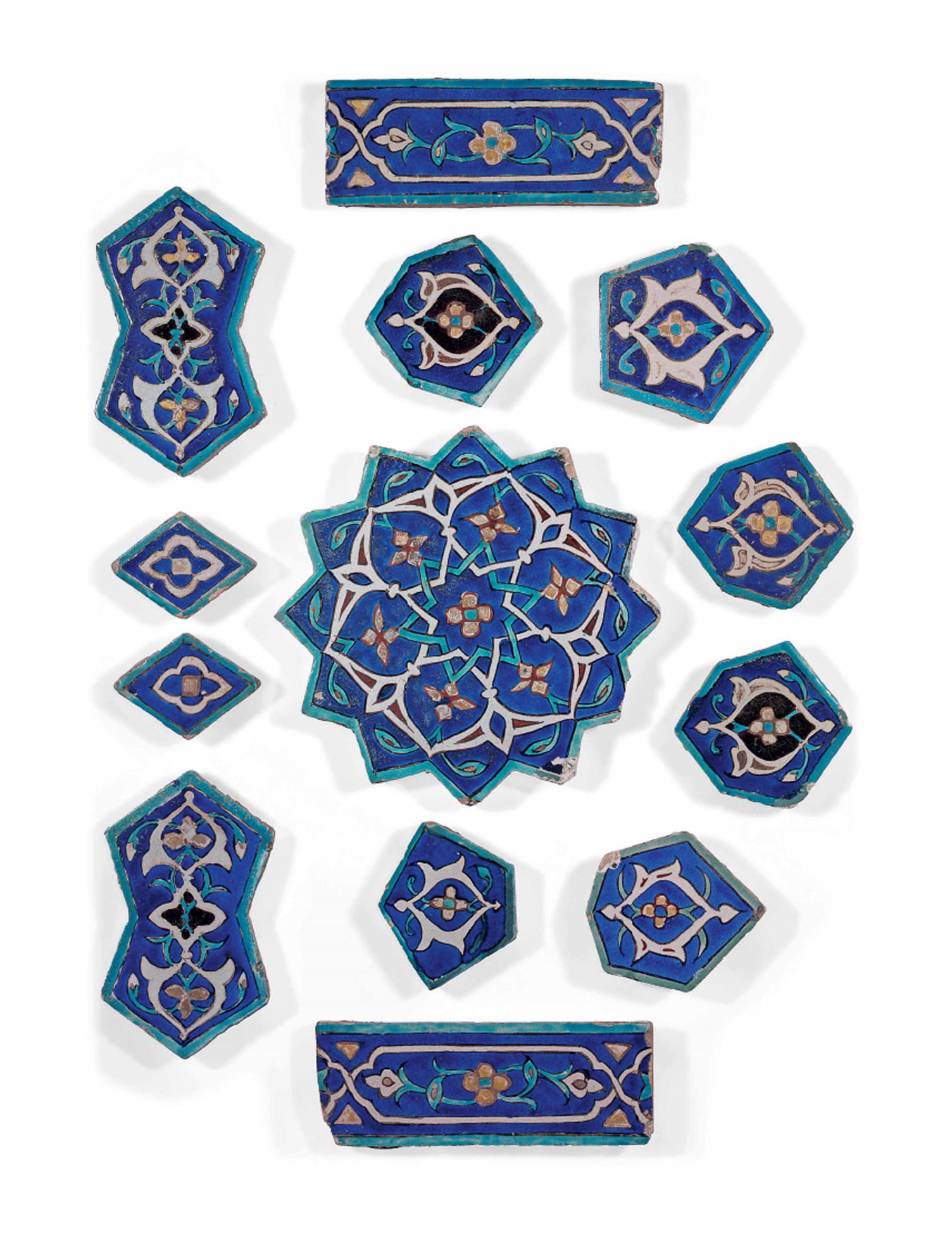 A GROUP OF POLYGONAL TIMURID CUERDA SECA POTTERY TILES , PROBABLY ...