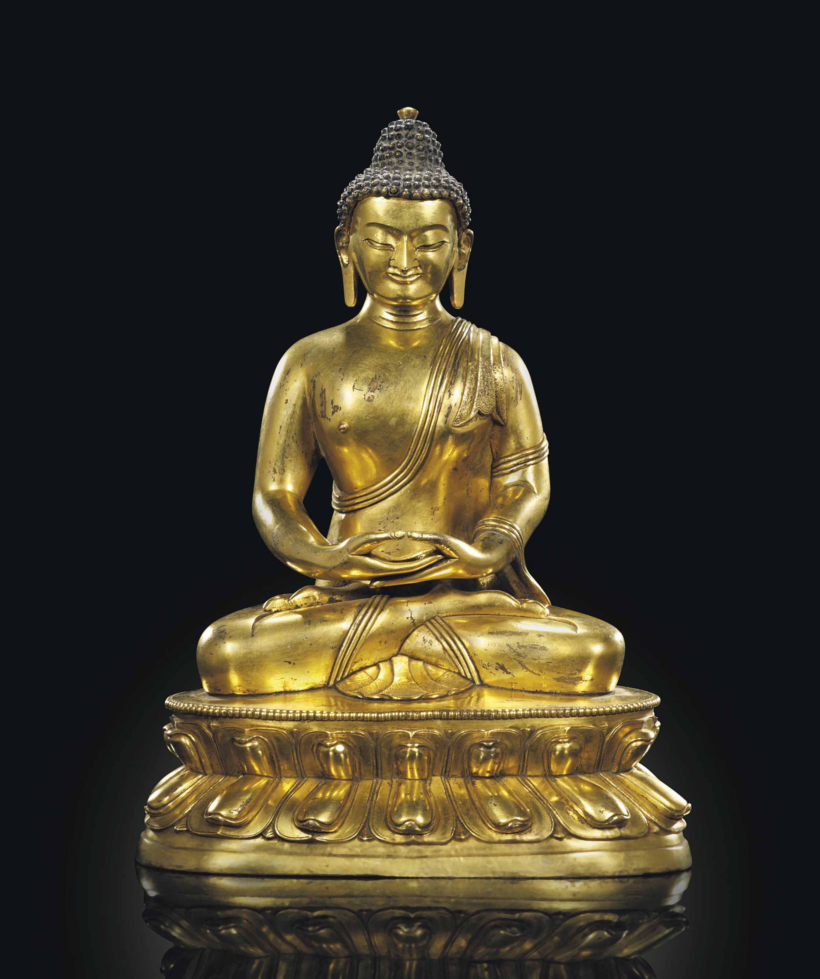 A GILT-BRONZE FIGURE OF SAKYAMUNI , 17TH CENTURY | Christie's