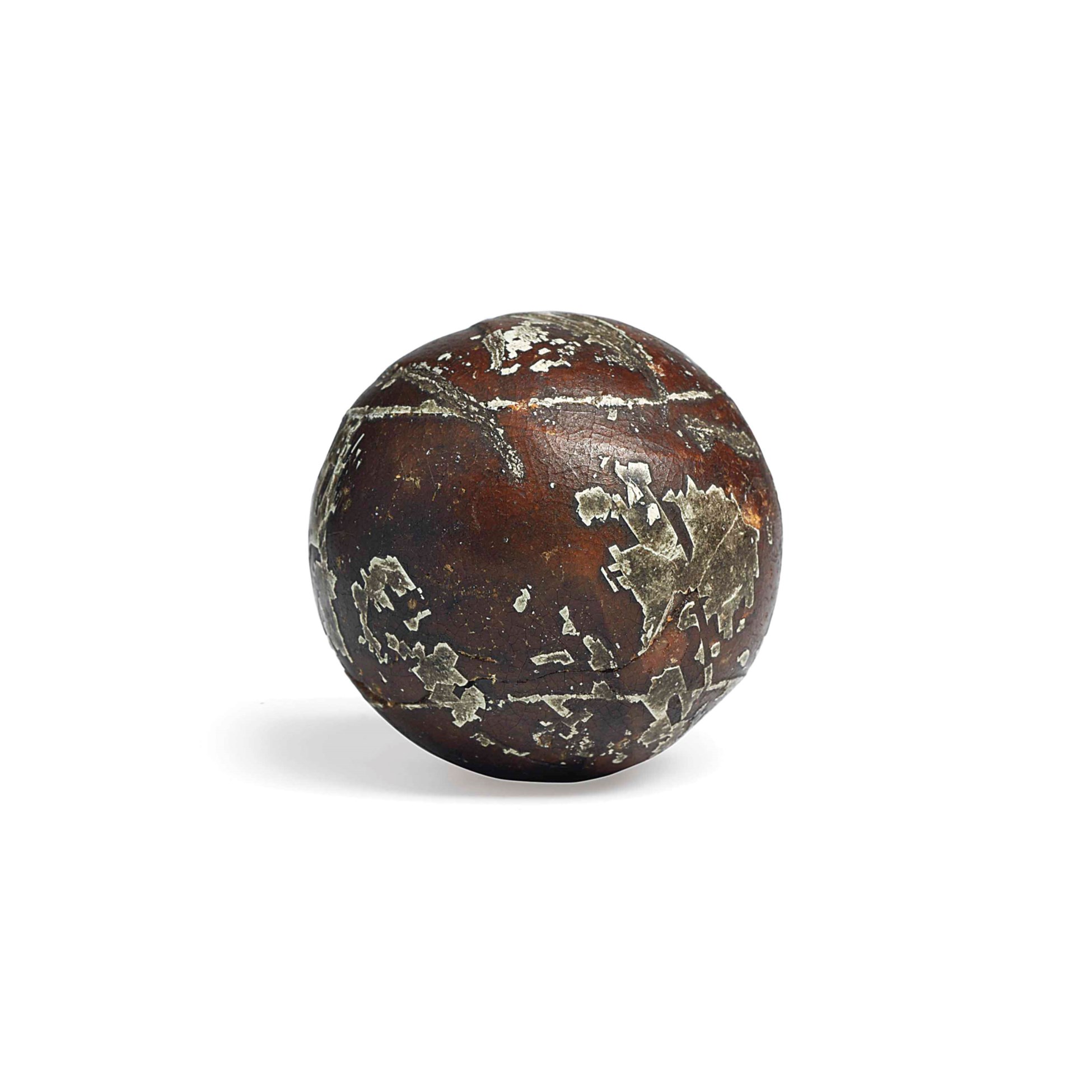 AN EXTREMELY RARE GUTTA-PERCHA GOLF BALL HAMMERED AND MOULDED TO ...