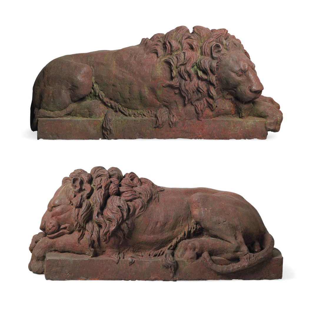A PAIR OF CAST IRON RECUMBENT LIONS , 20TH CENTURY, AFTER ANTONIO ...