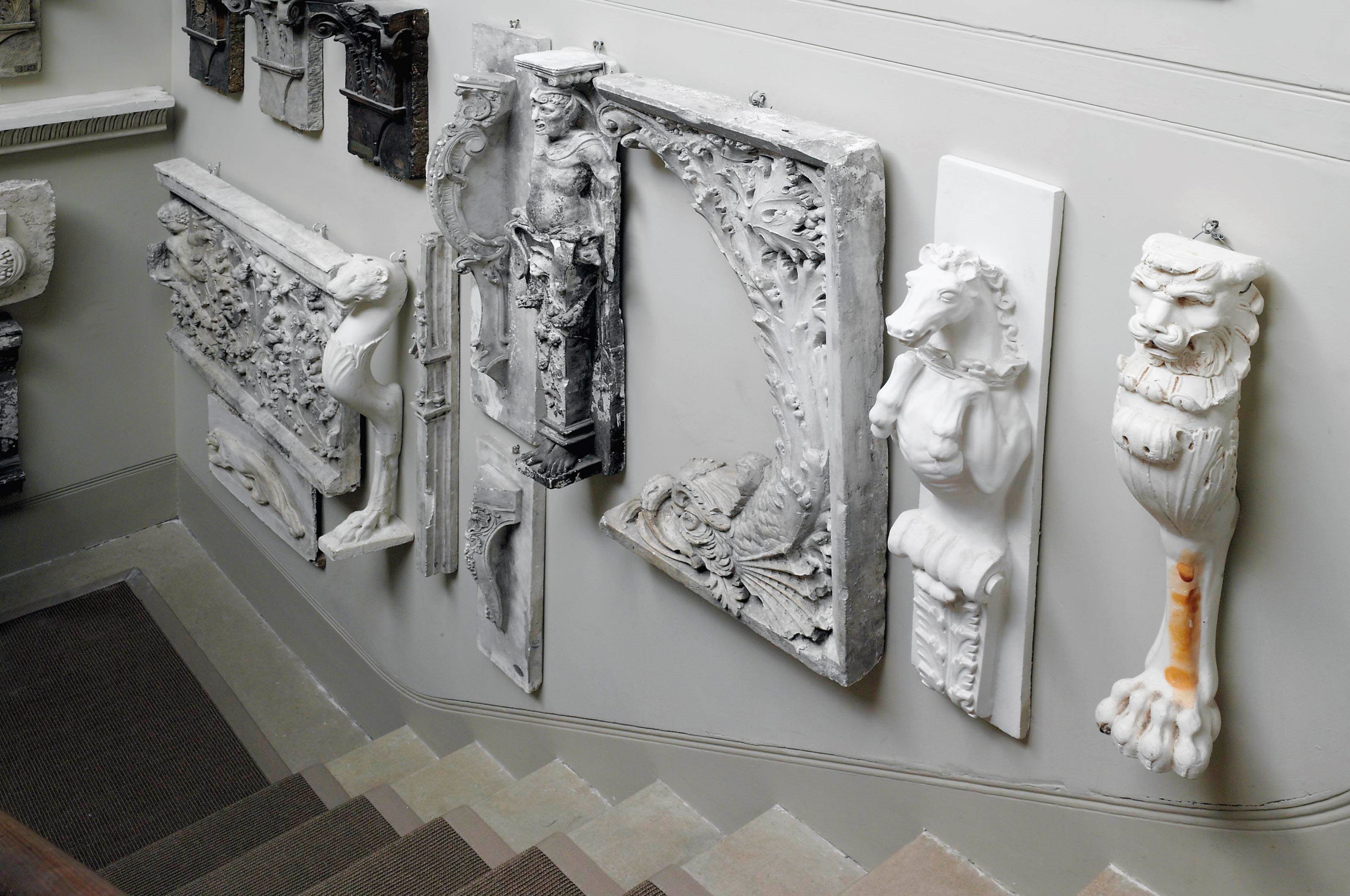 A COLLECTION OF THIRTEEN PLASTER CASTS OF ARCHITECTURAL FRAGMENTS