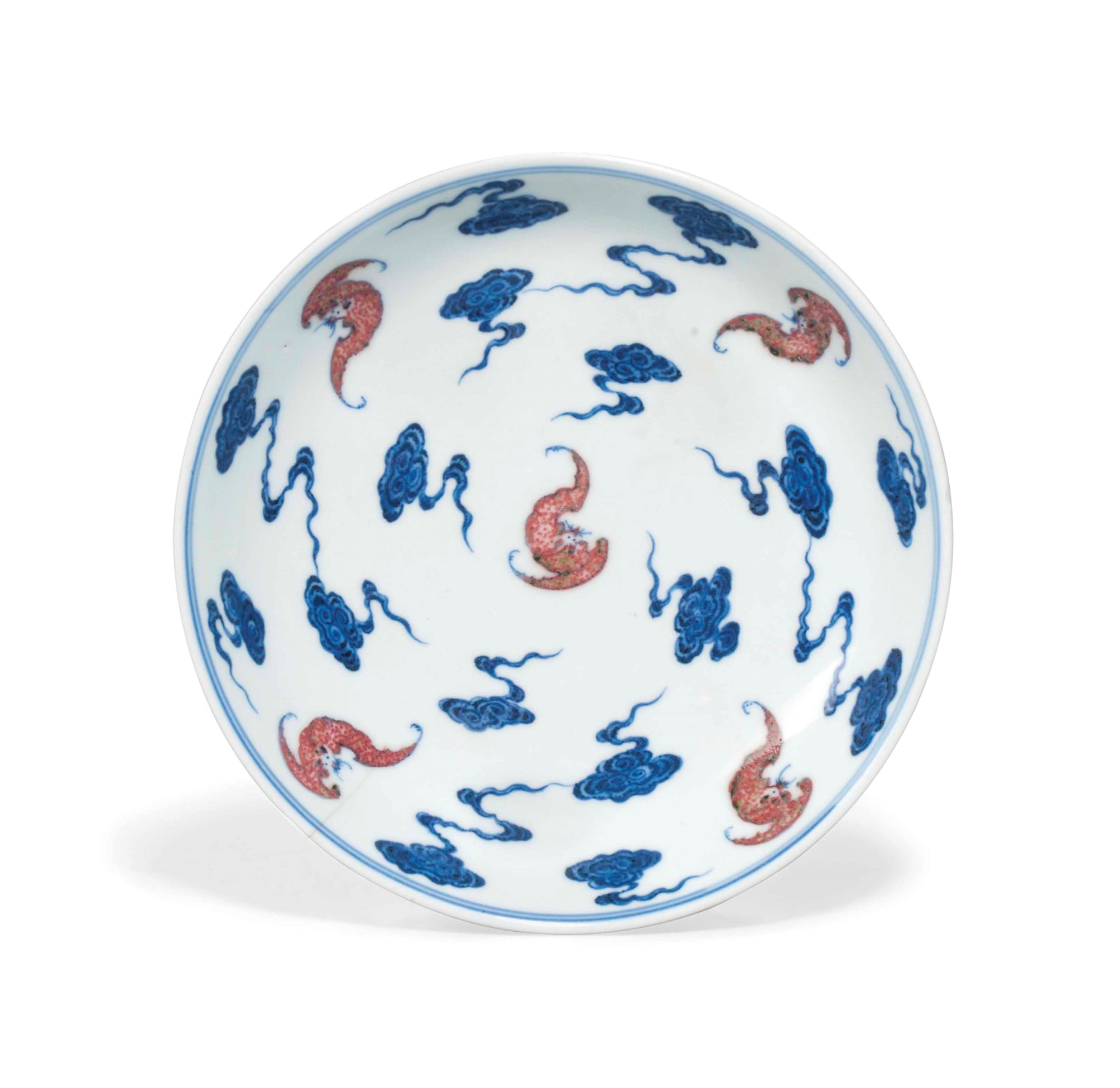 A CHINESE COPPER RED AND UNDERGLAZE-BLUE BAT AND CLOUD DISH