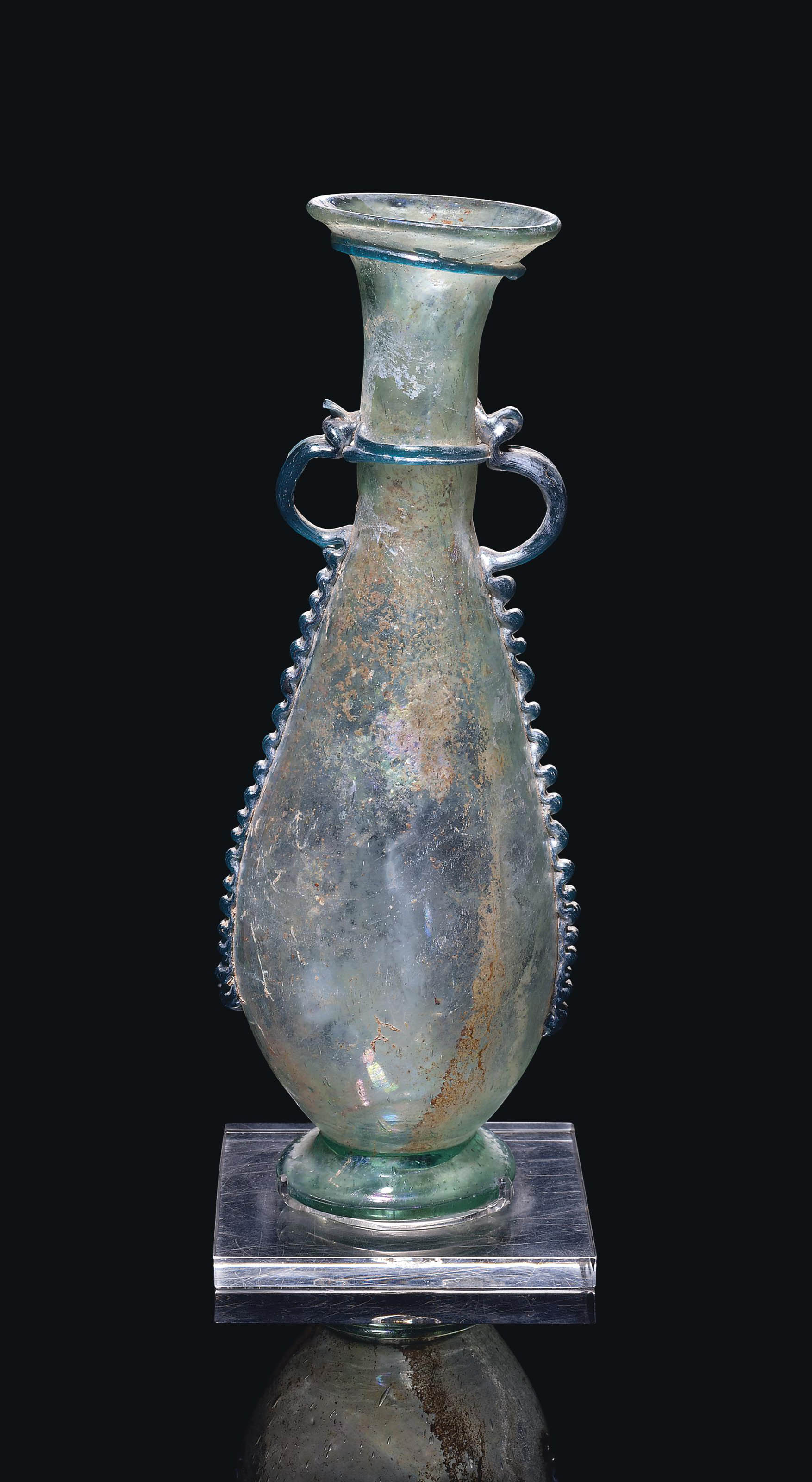 A GREEK PALE GREEN GLASS SKYPHOS , HELLENISTIC PERIOD, CIRCA 2ND-MID ...