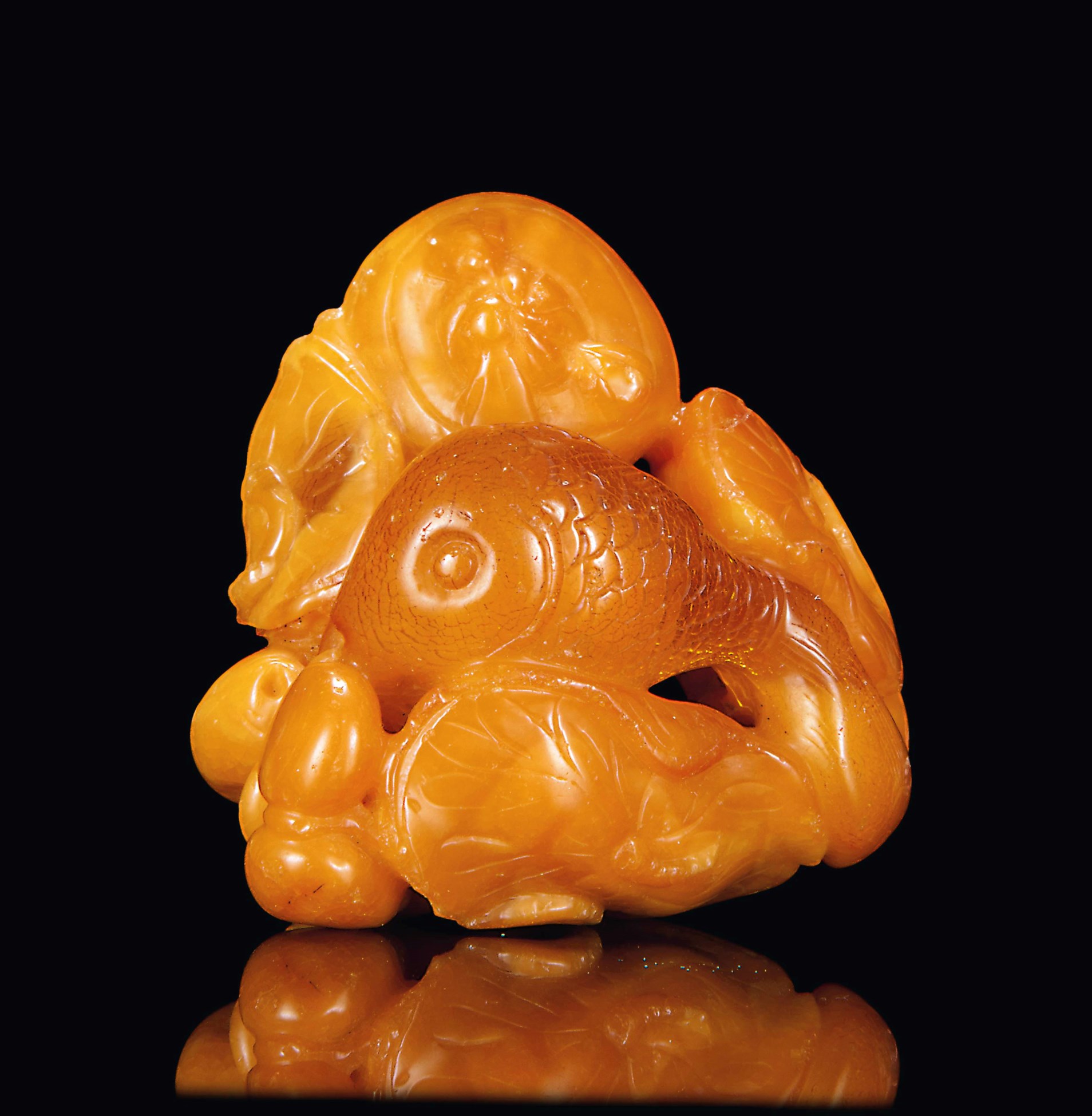 A CHINESE AMBER CARVING OF AN AQUATIC LIFE GROUP , 18TH/19TH CENTURY ...