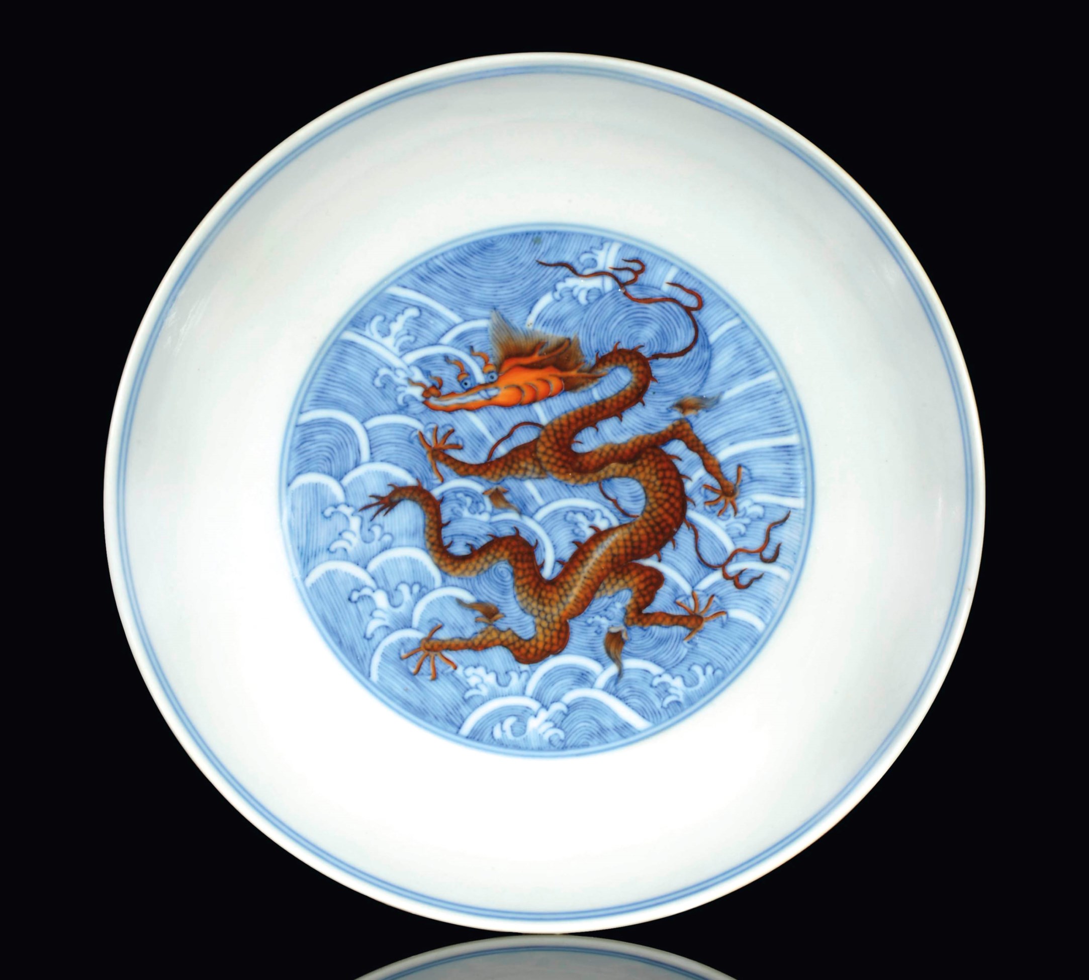 A CHINESE IRON-RED-DECORATED BLUE AND WHITE DRAGON DISH , QIANLONG ...