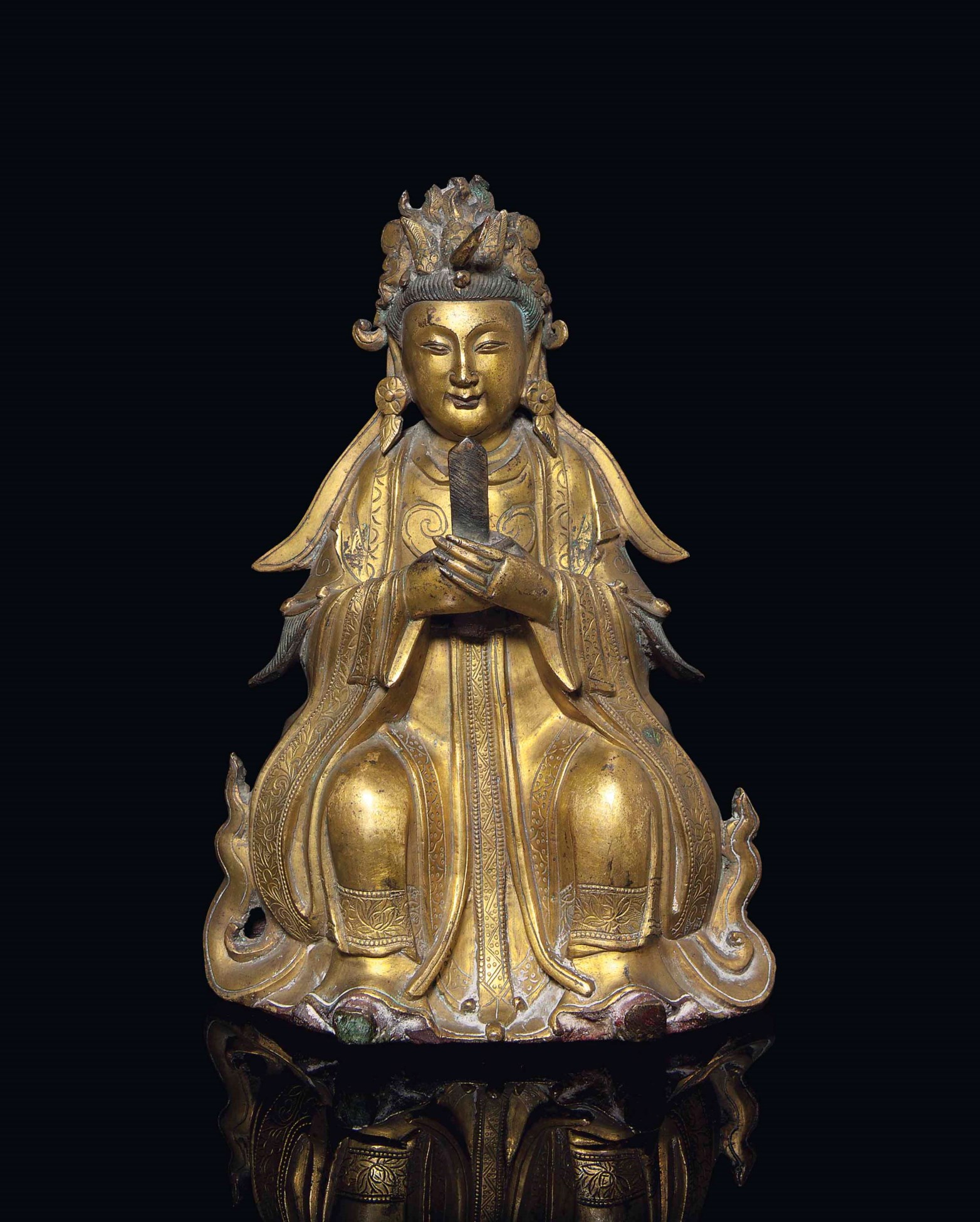 A GILT BRONZE FIGURE OF XI WANG MU