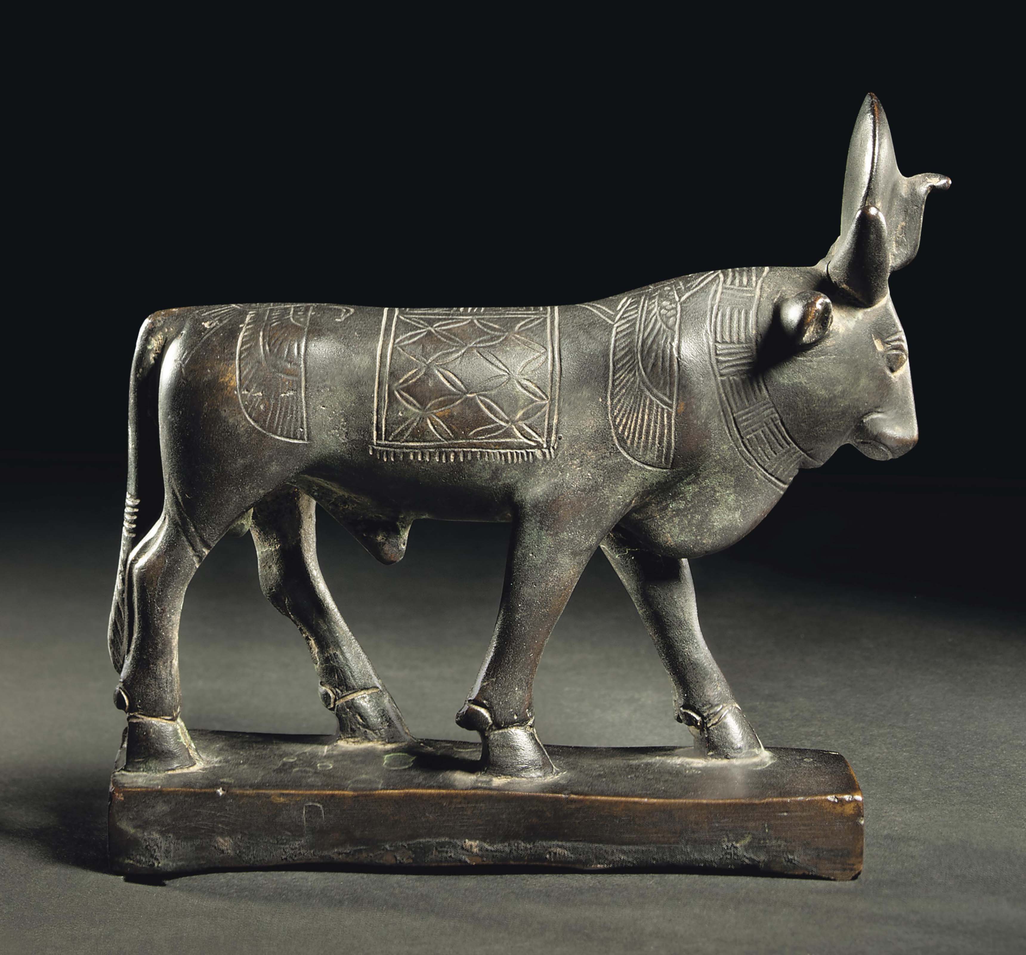 AN EGYPTIAN BRONZE APIS BULL , LATE PERIOD, XXVI DYNASTY, CIRCA 664-525 ...