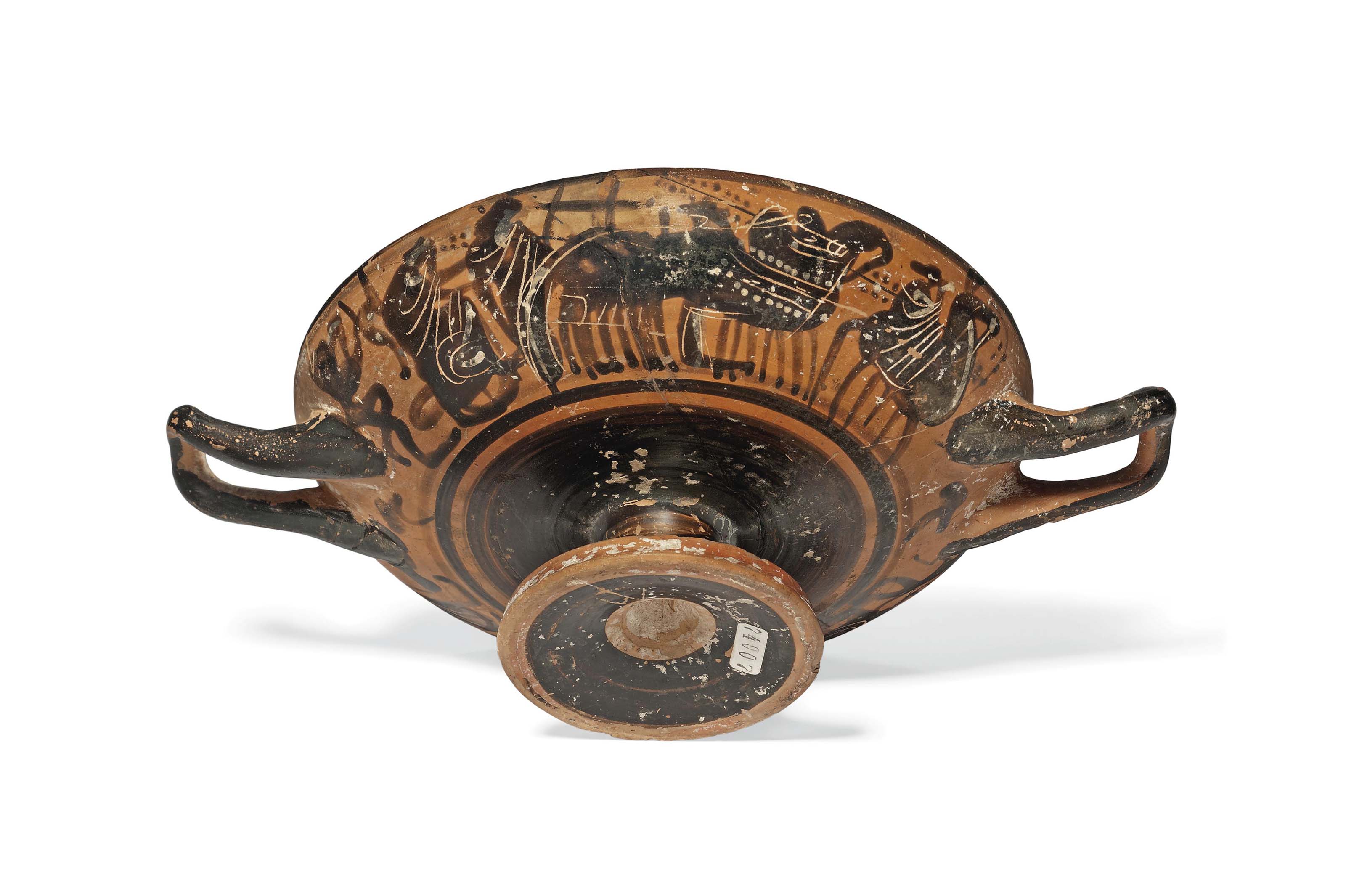 AN APULIAN RED-FIGURED STEMLESS KYLIX , ATTRIBUTED TO THE BITONTO GROUP ...