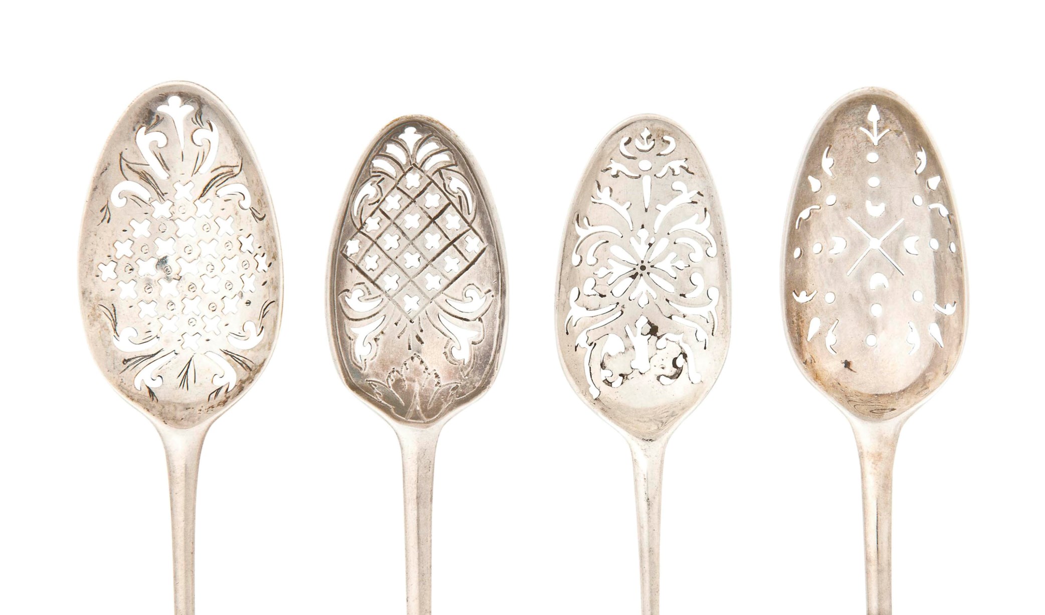 A GROUP OF FOURTEEN GEORGE I/II/III SILVER MOTE SPOONS , VARIOUS DATES ...