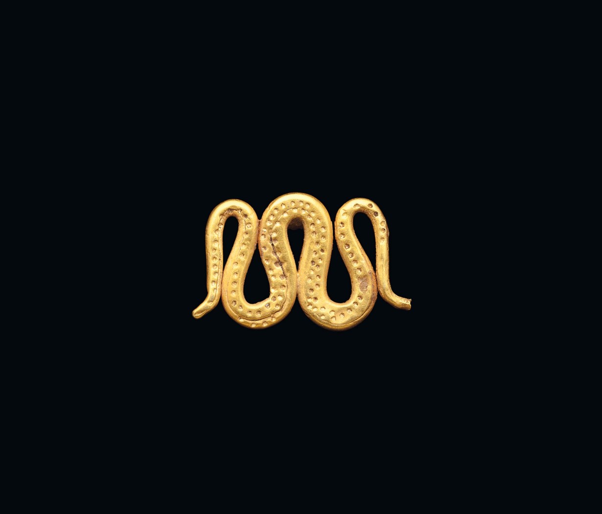 AN EGYPTIAN GOLD COILED SNAKE AMULET , PTOLEMAIC-ROMAN PERIOD, CIRCA ...