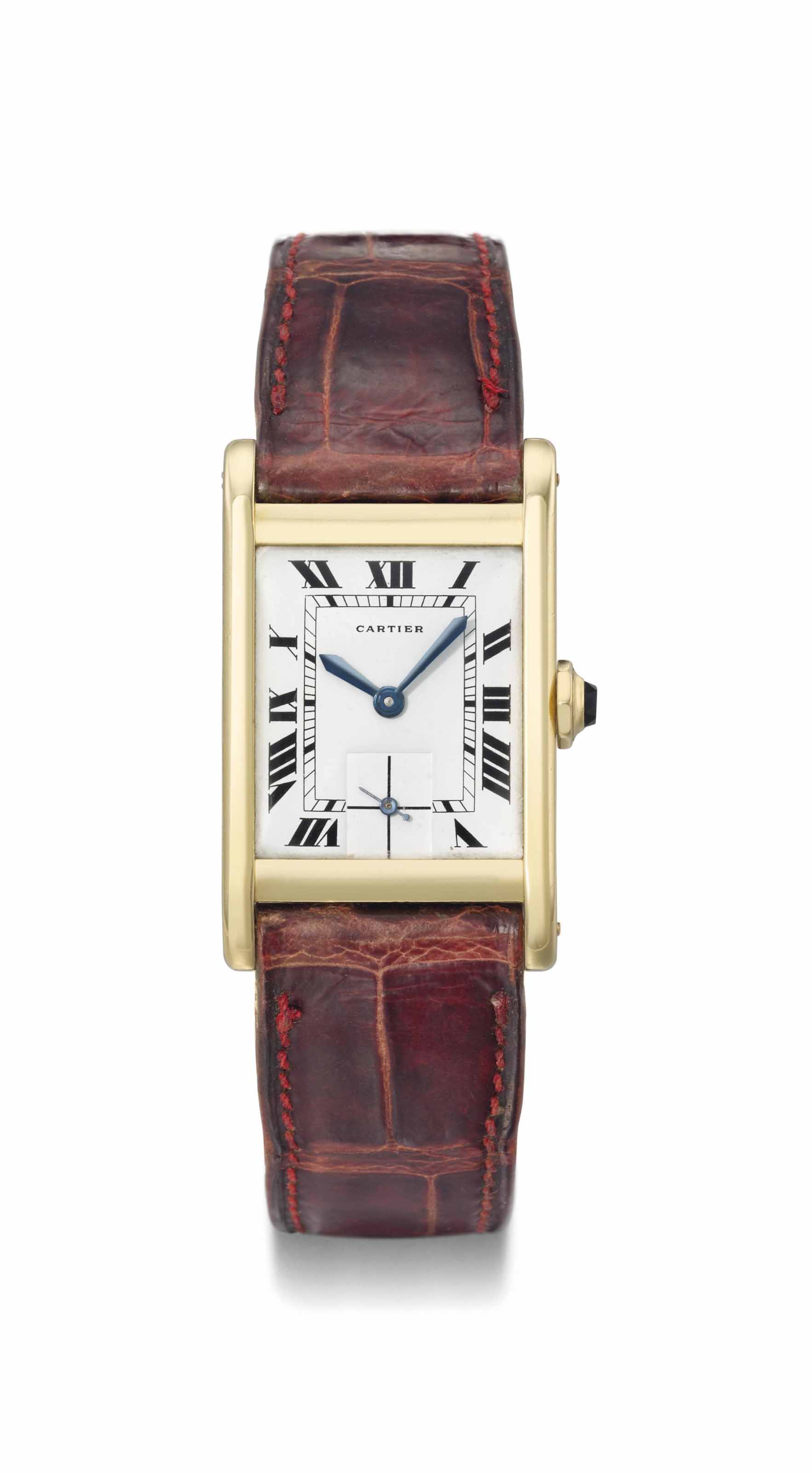 Cartier. A lady's 18K gold rectangular wristwatch with white dial