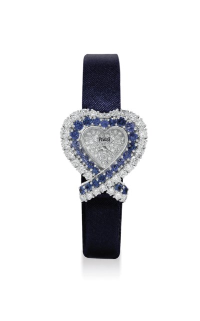 PIAGET. A LADY'S FINE 18K WHITE GOLD, DIAMOND AND SAPPHIRE-SET HEART ...