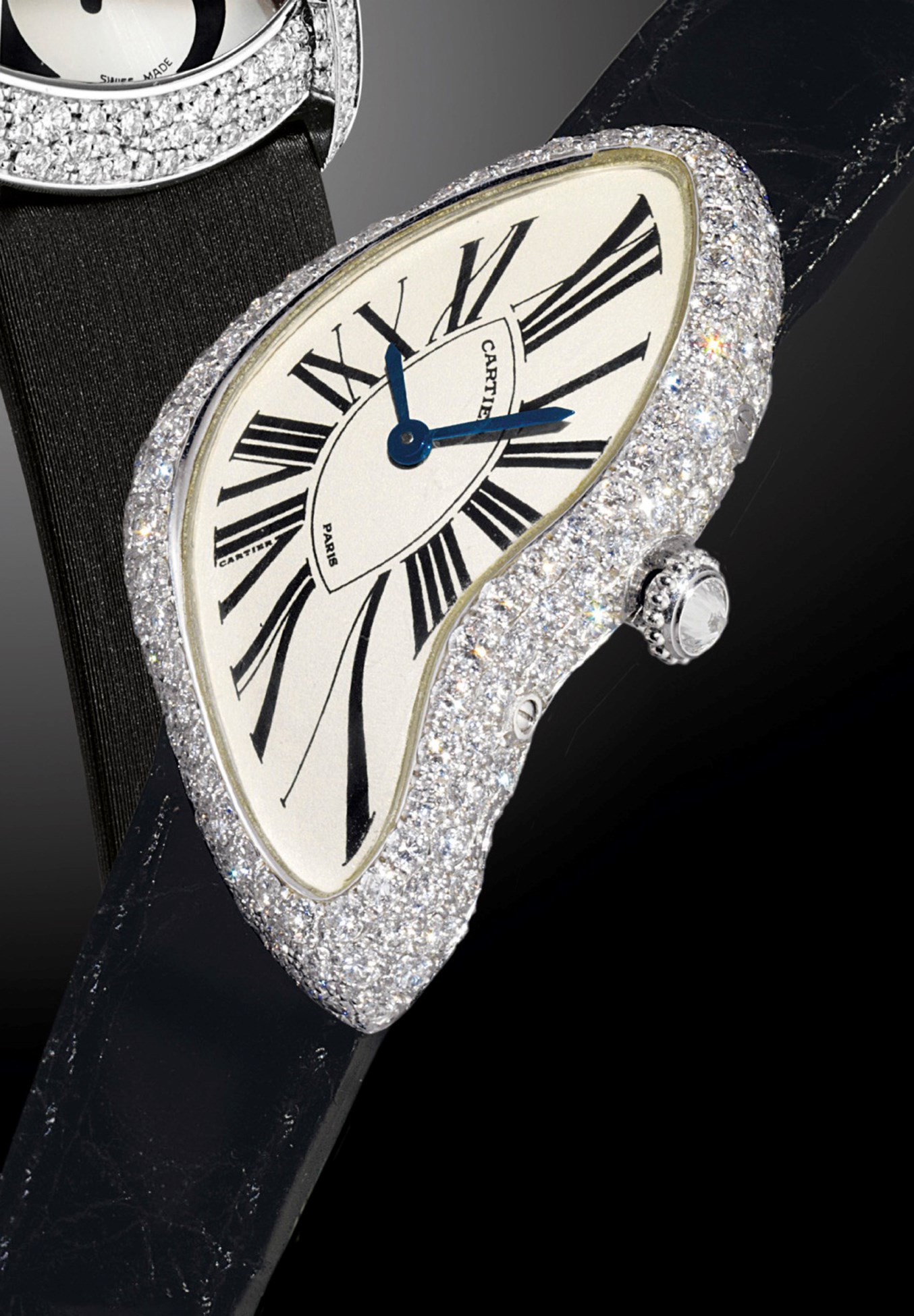 CARTIER. A FINE AND RARE LADY'S 18K WHITE GOLD AND DIAMOND-SET ...