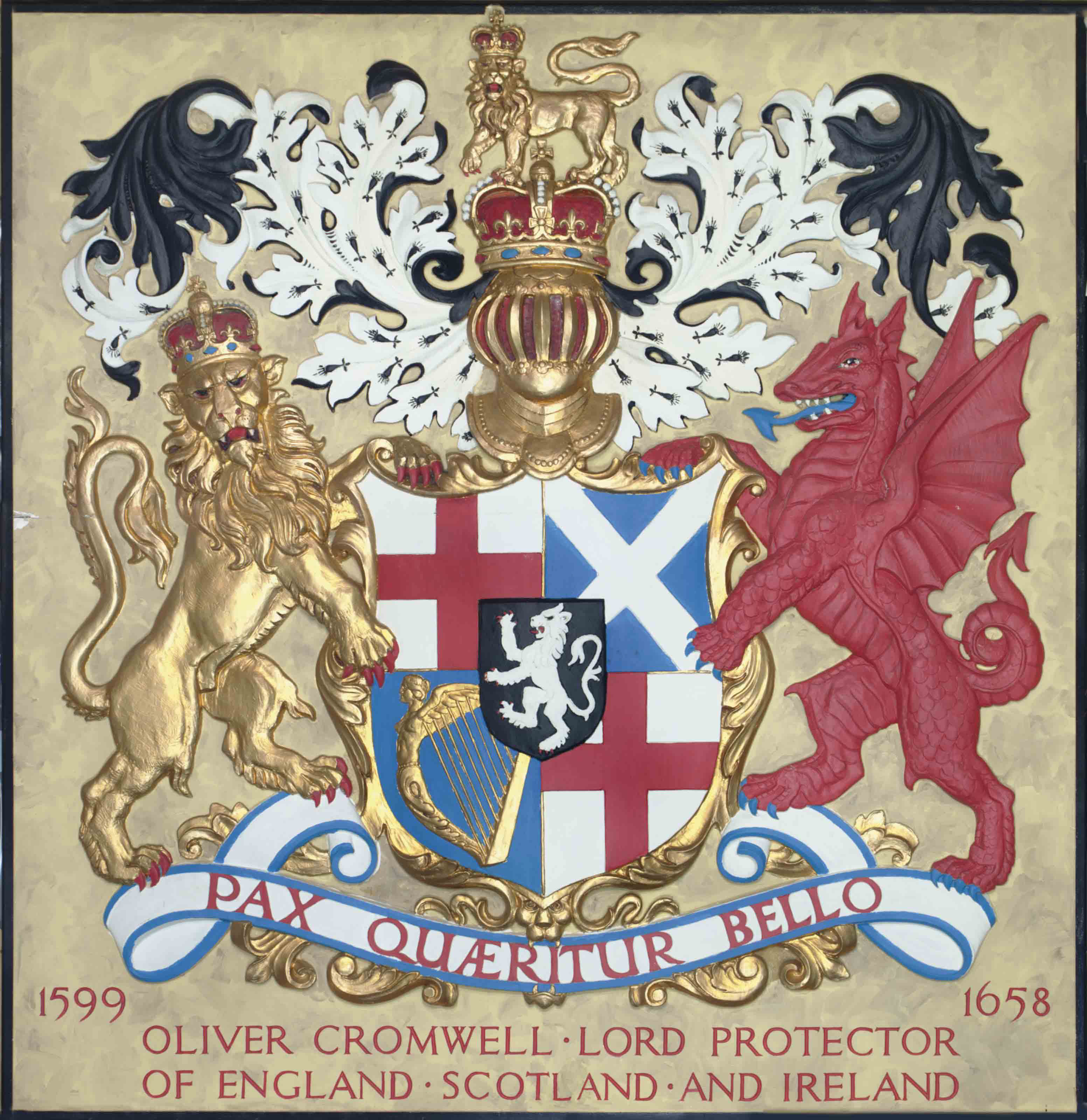 A MASSIVE POLYCHROME DECORATED AND PARCEL-GILT PLASTER HERALDIC PANEL ...