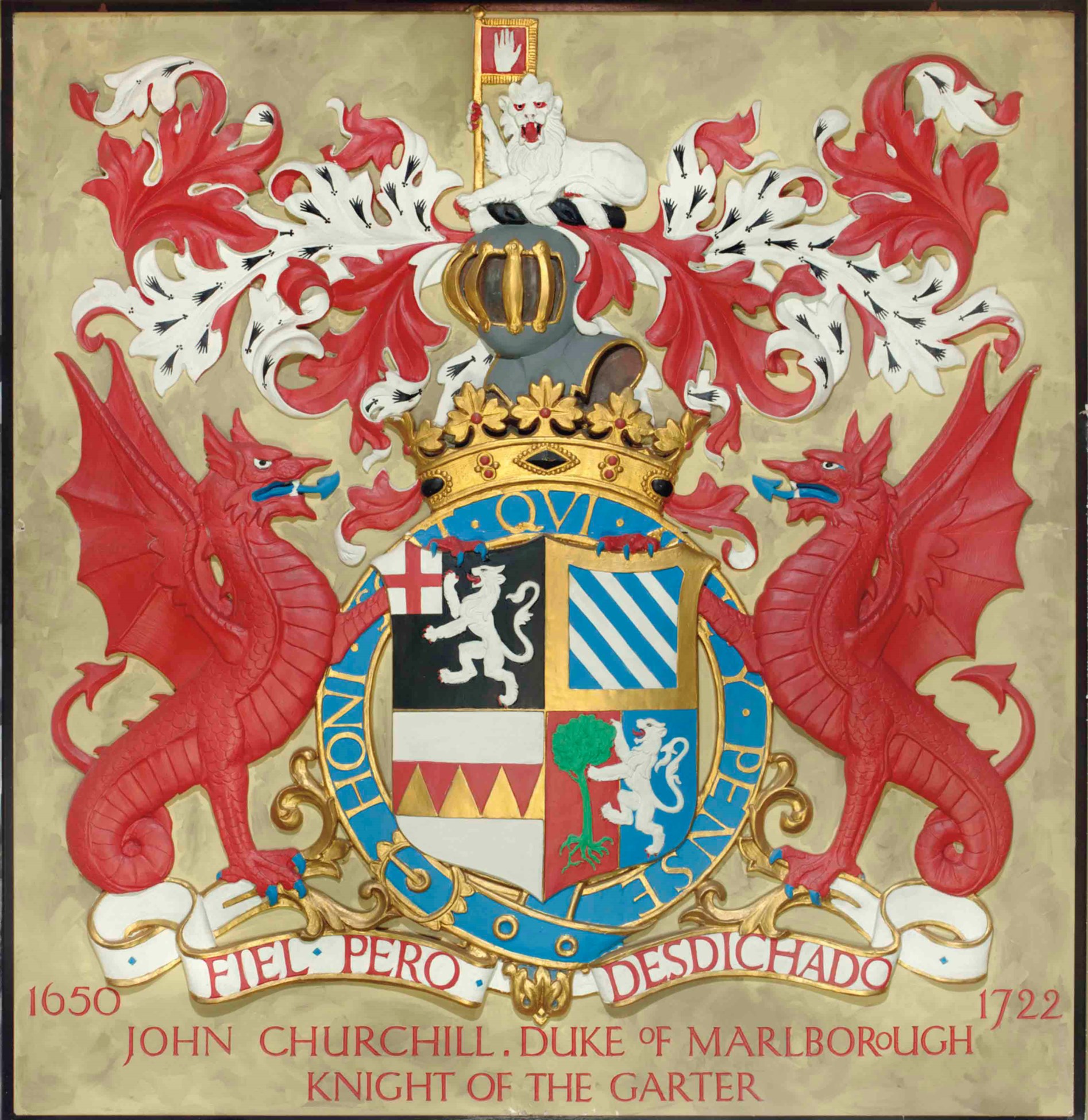 A MASSIVE POLYCHROME DECORATED AND PARCEL-GILT PLASTER HERALDIC PANEL ...